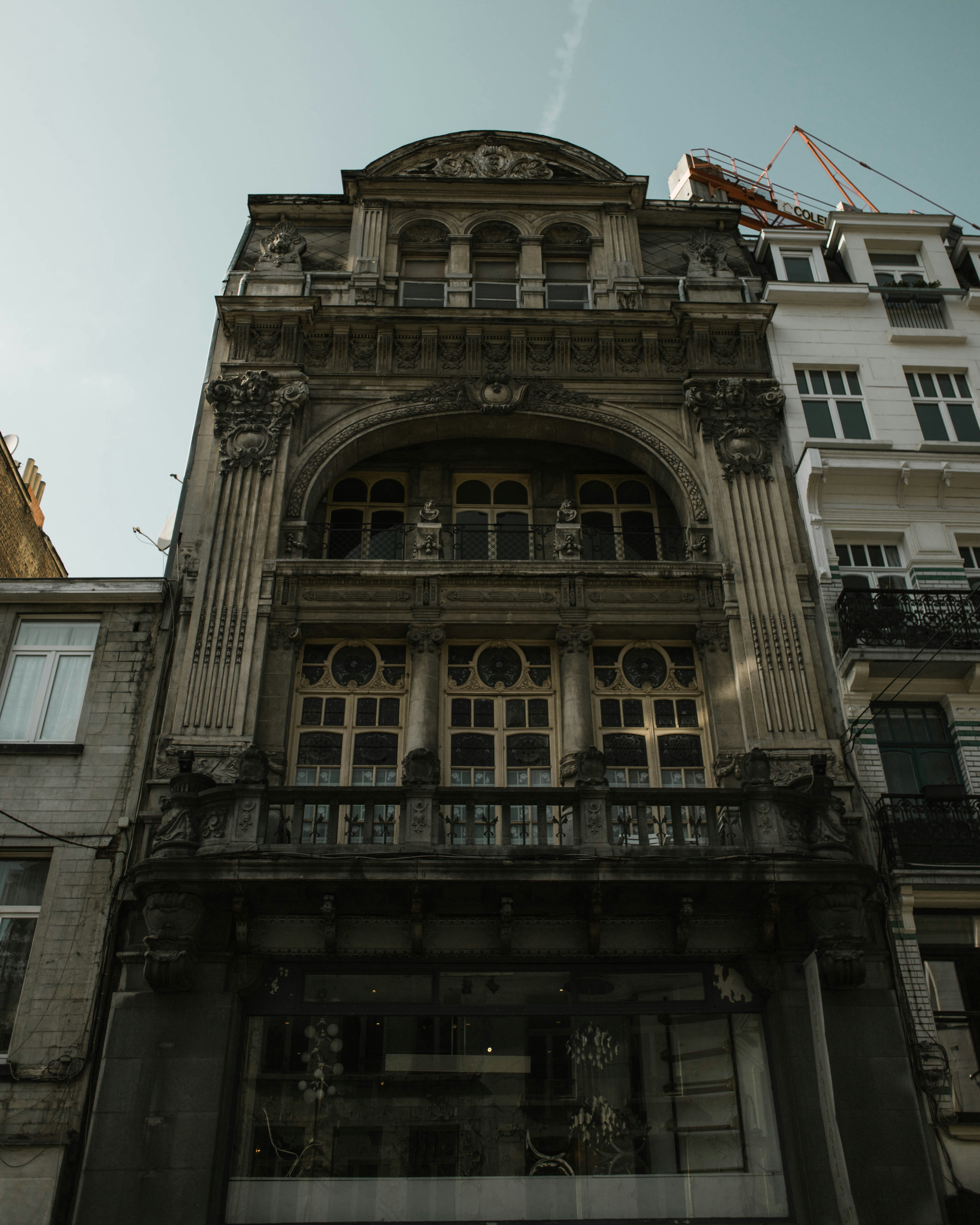 Ornate Facade of a Vintage-Style Building with Framed Archway