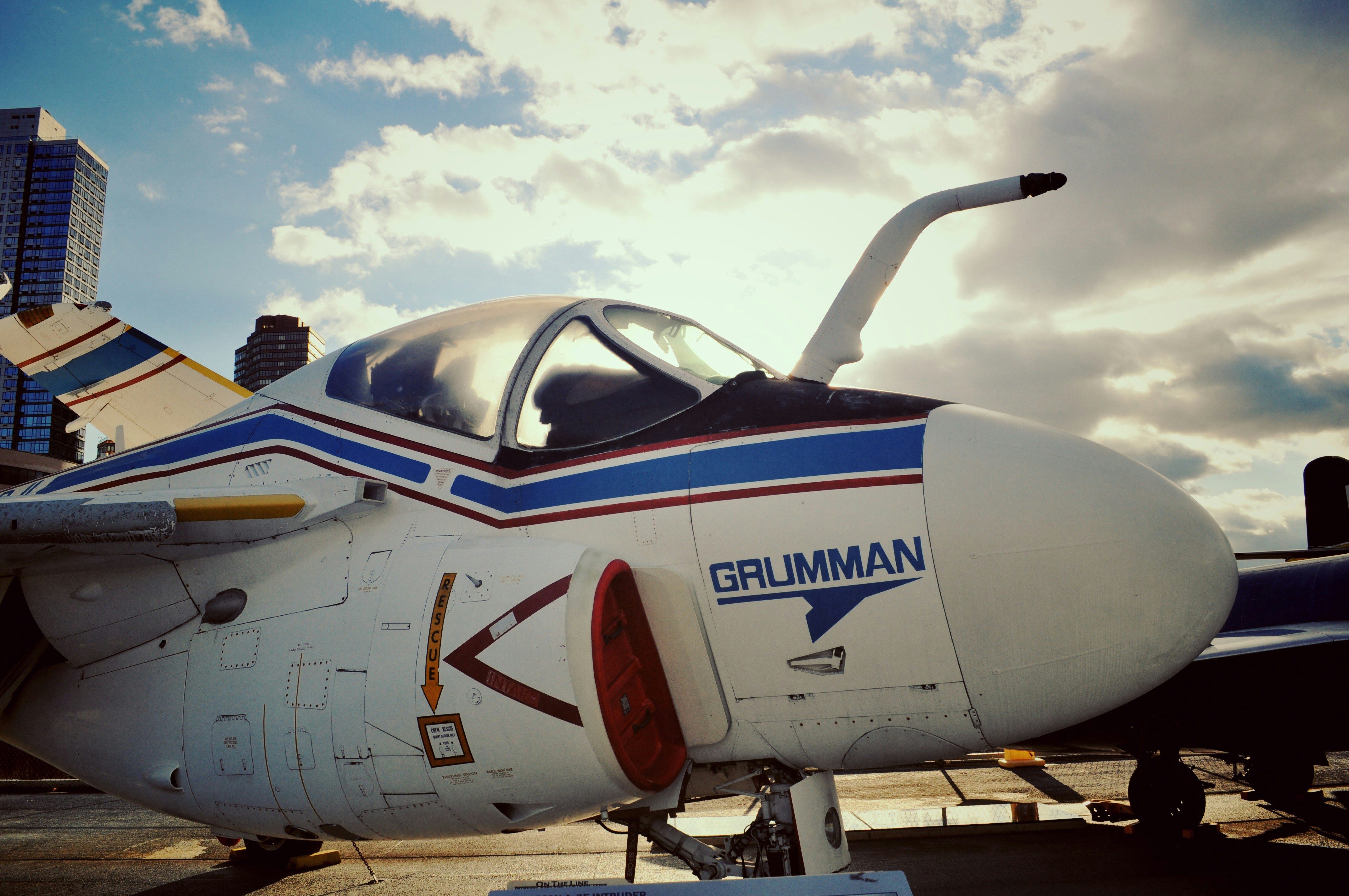 Grumman aircraft showcased against a dramatic sky, highlighting its iconic design and engineering prowess.