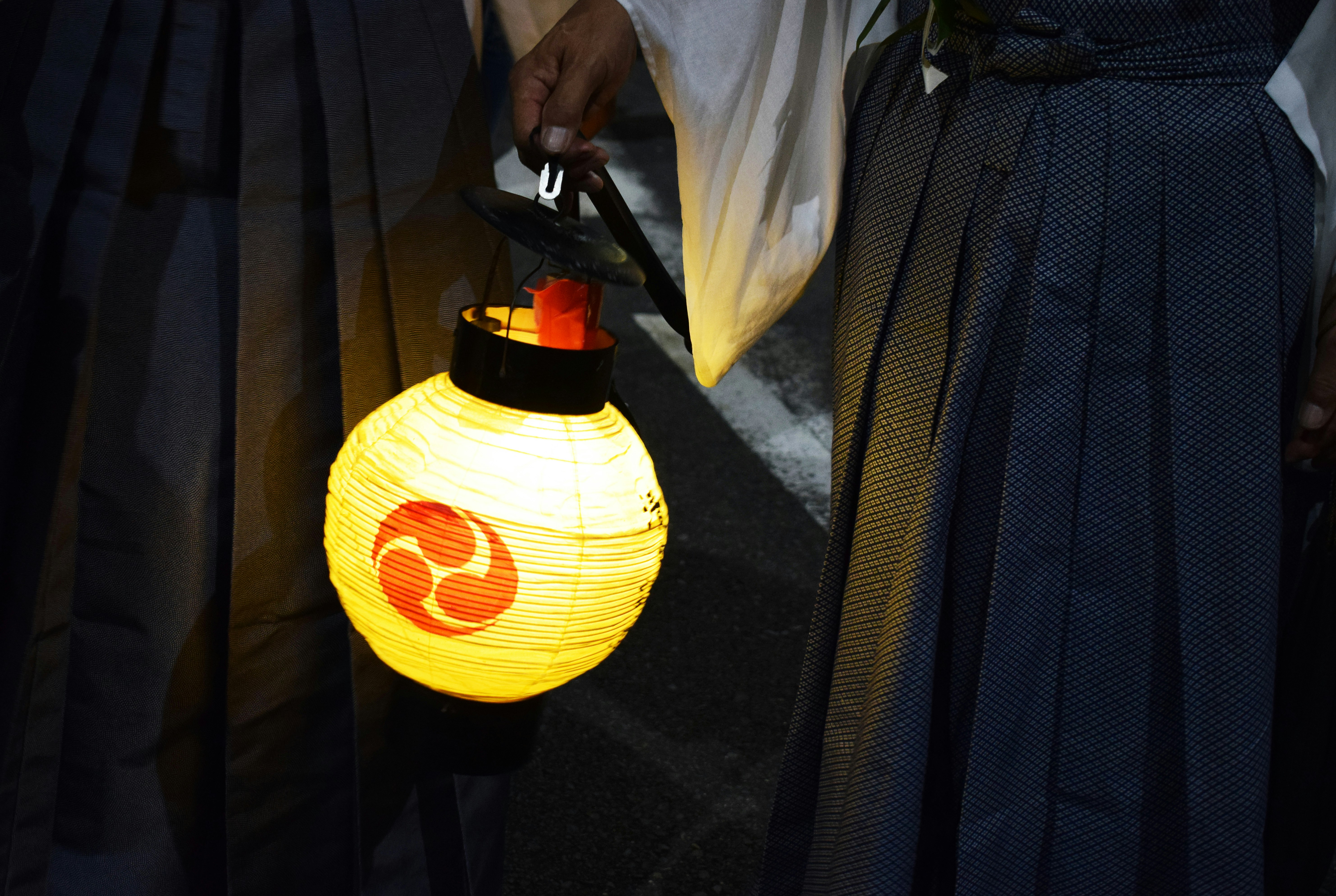 Amber Lantern Between Shadows: A Night Moment of Ceremony