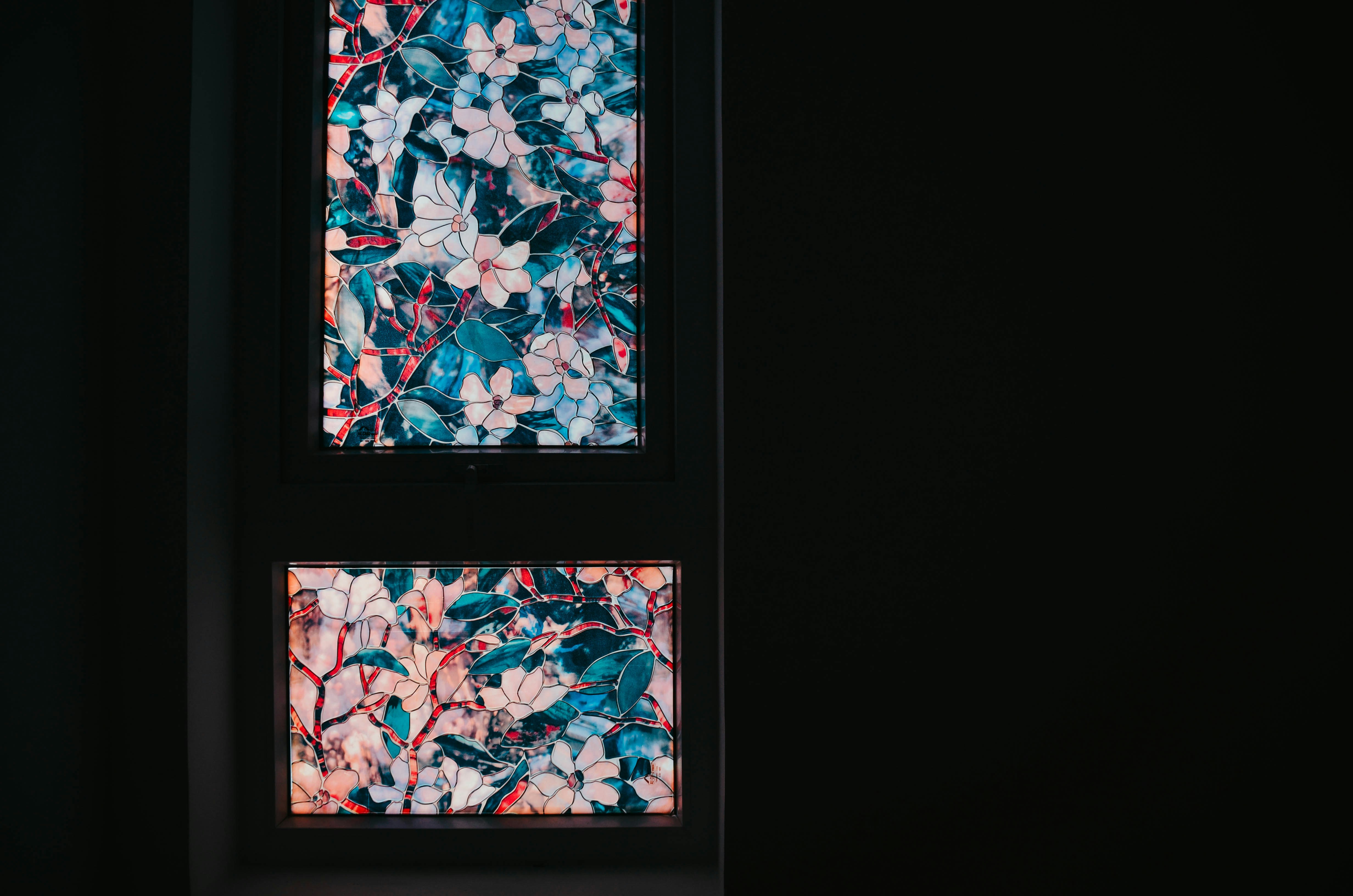 Hidden Window Garden: A Pair of Stained Panels in a Dark Corridor