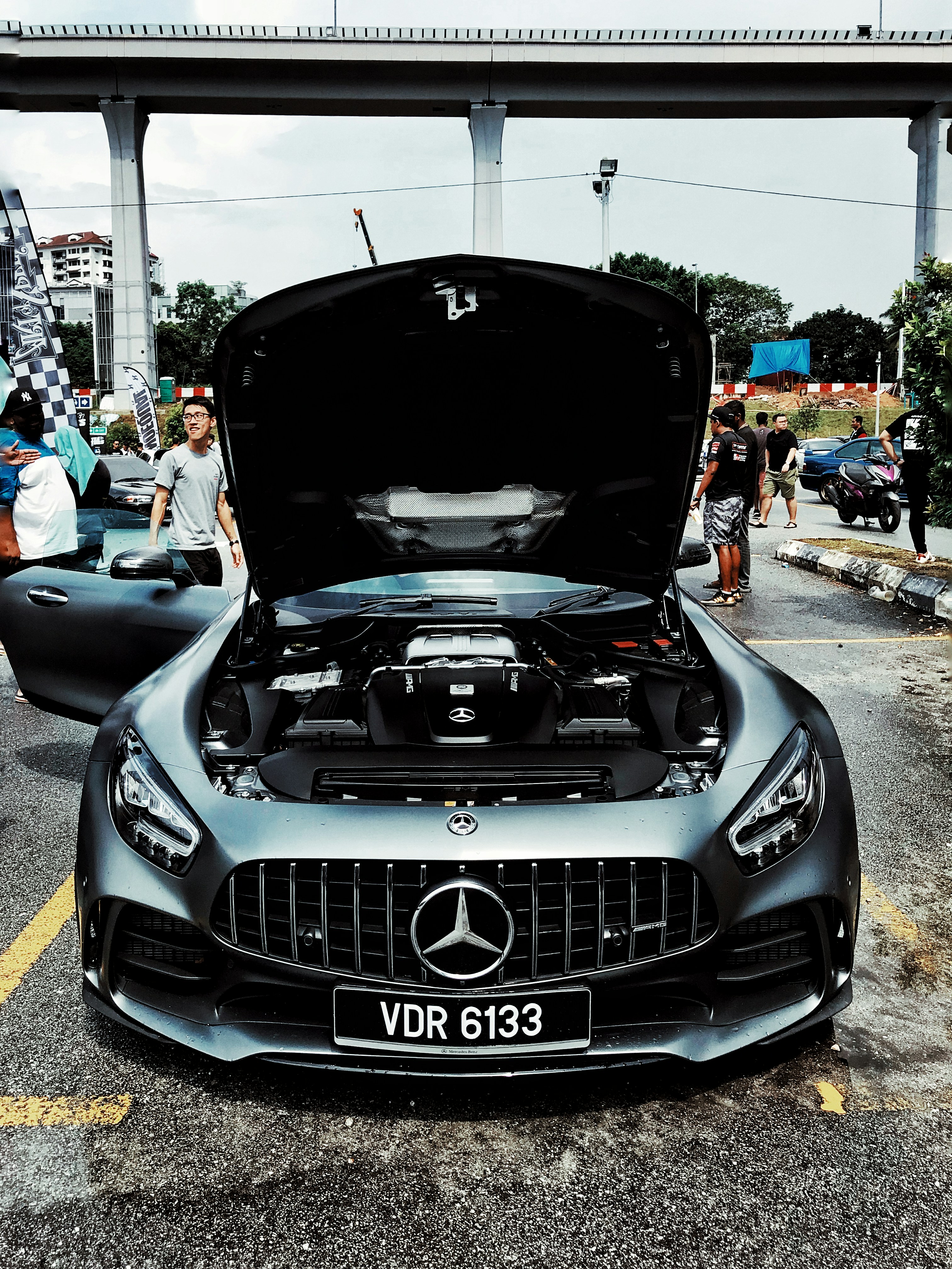 Front-and-Center Mercedes: Hood Raised at a Daylight Car Show