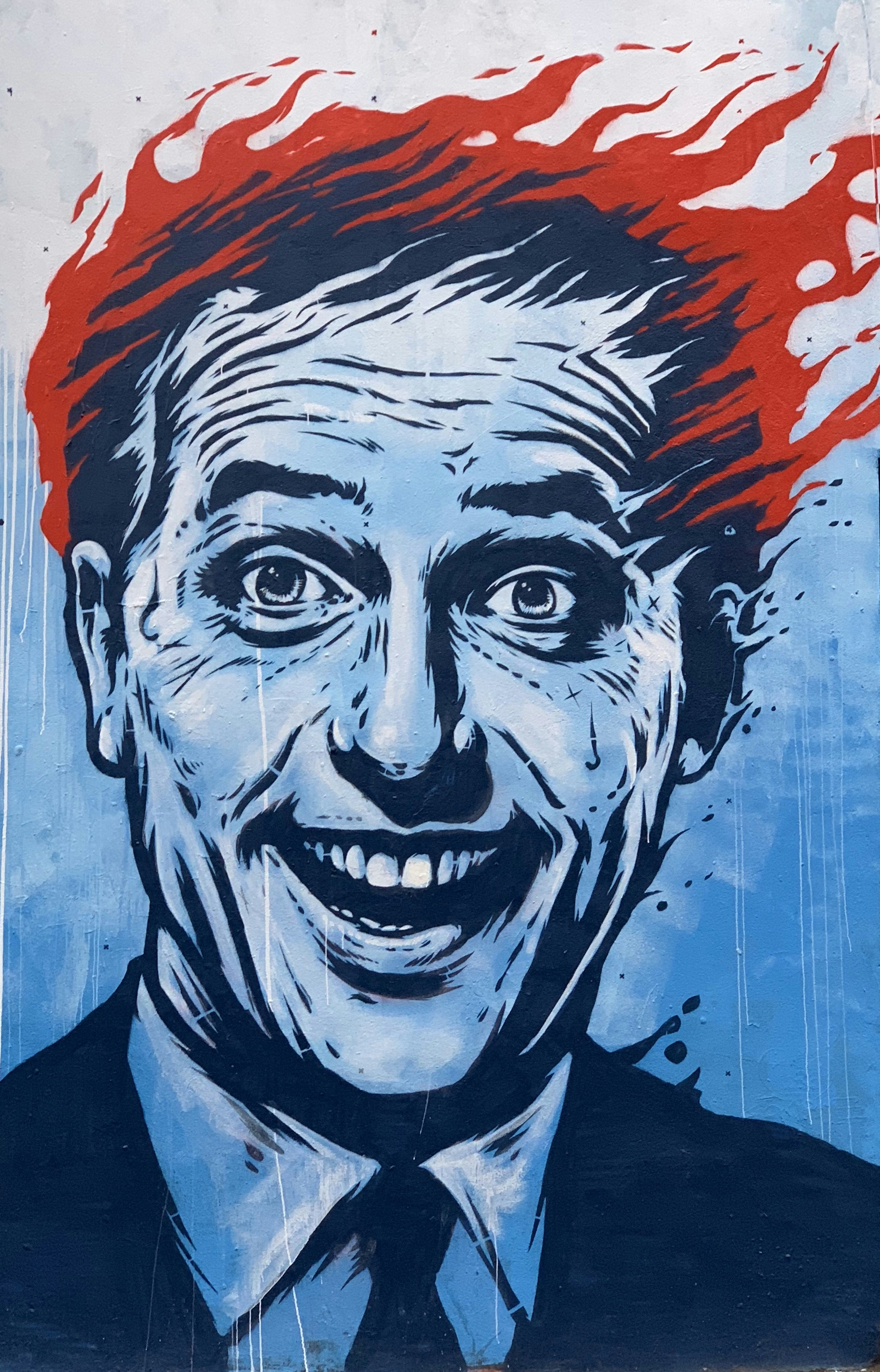 Electric Smiles: A Pop-Art Portrait in Blues and Crimson