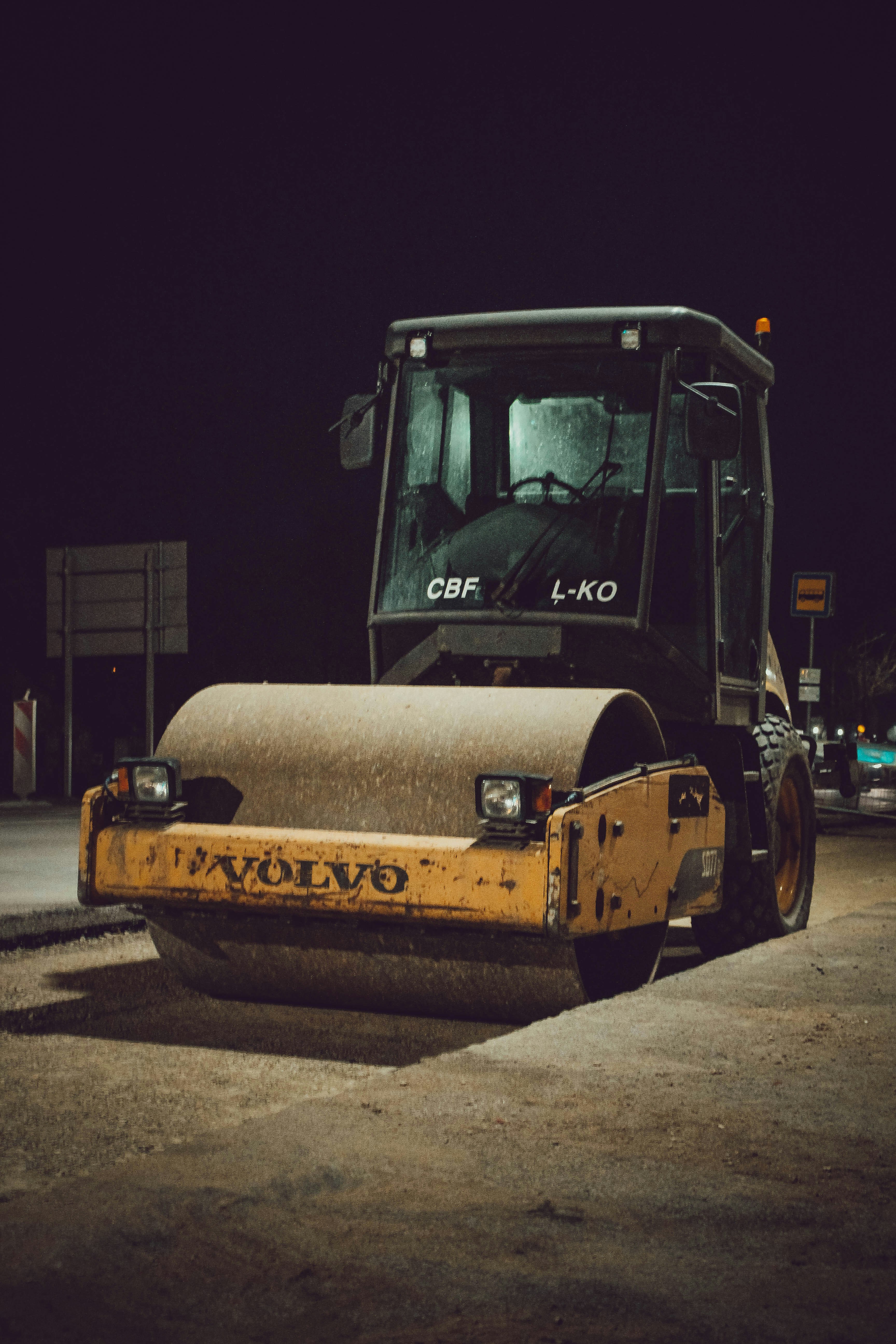 Night Roll: A Volvo Steamrolling Through Quiet Urban Street