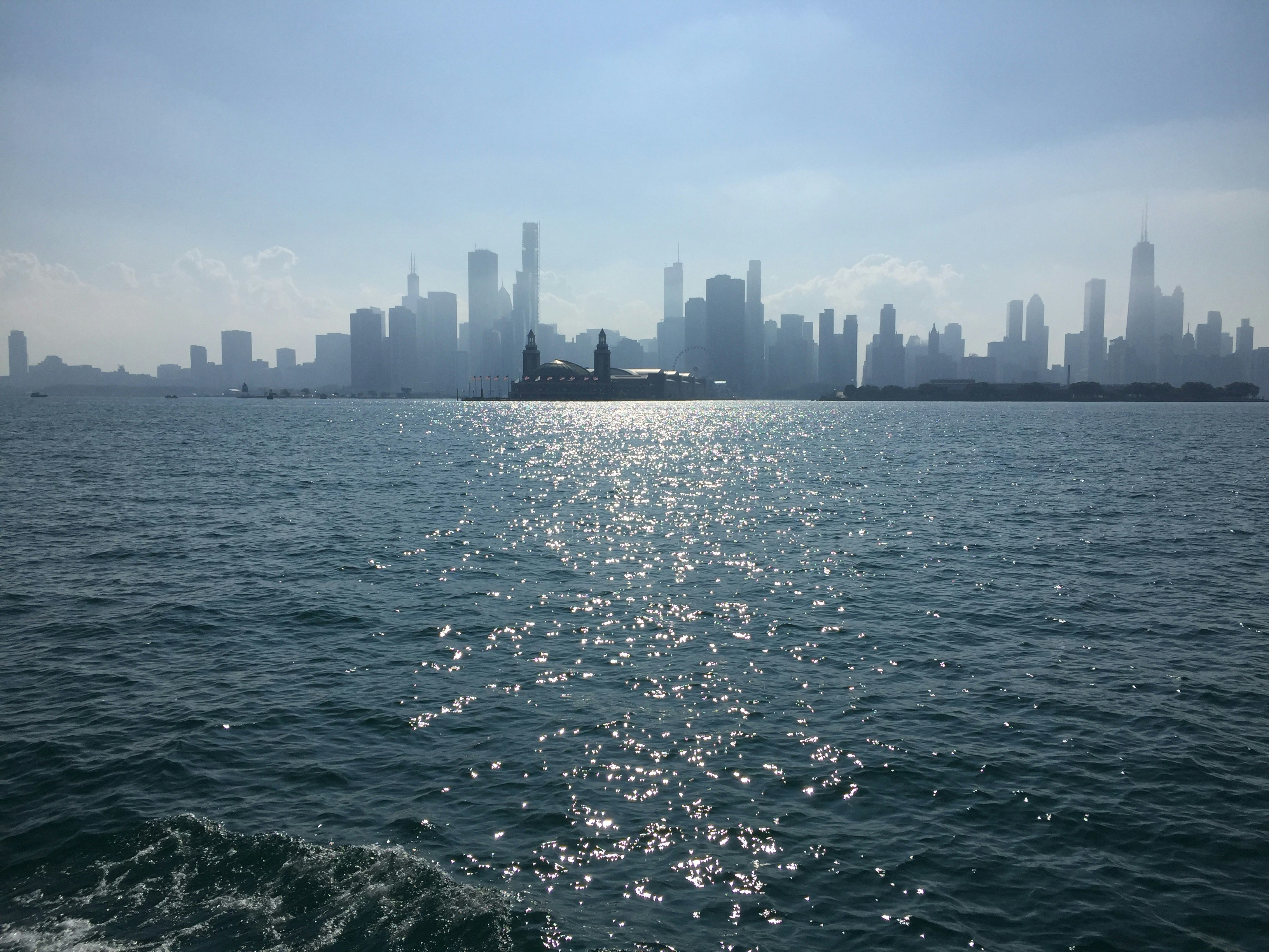 body of water near city buildings during daytime