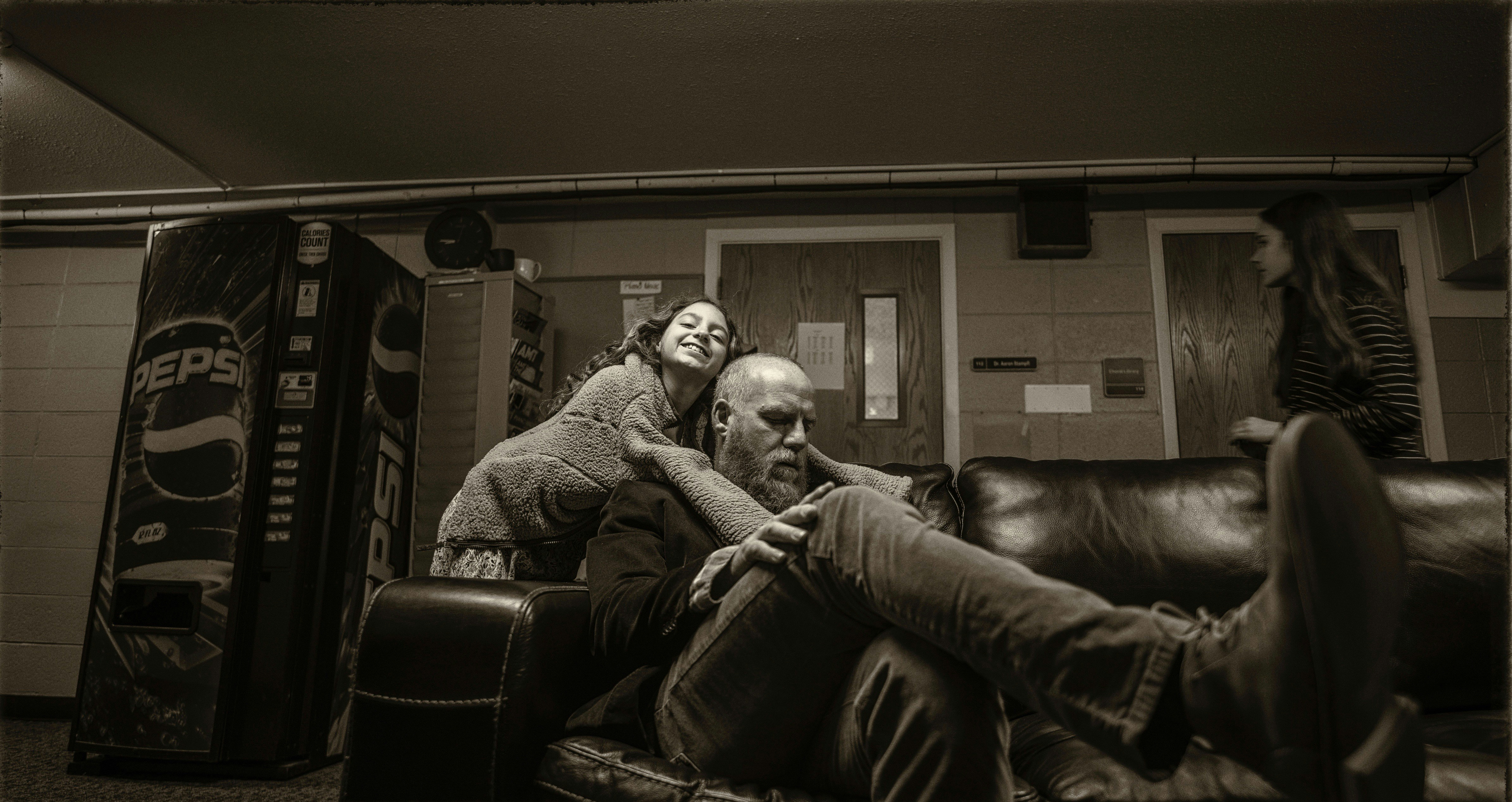 Man and woman sitting on black leather couch photo – Free Human Image ...
