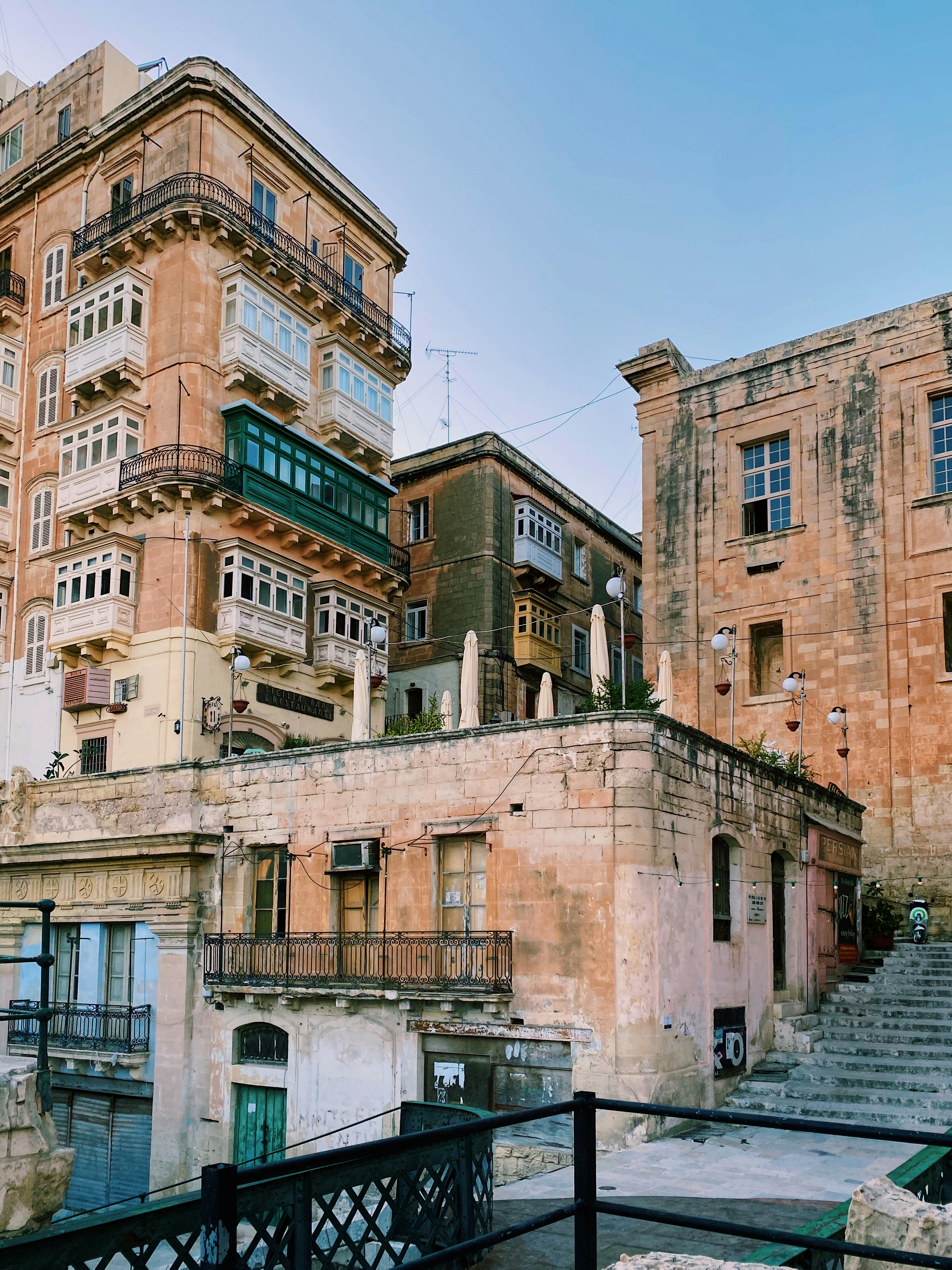 Sunlit Facades and Wrought-Balcony Geometry in a Mediterranean Quarter
