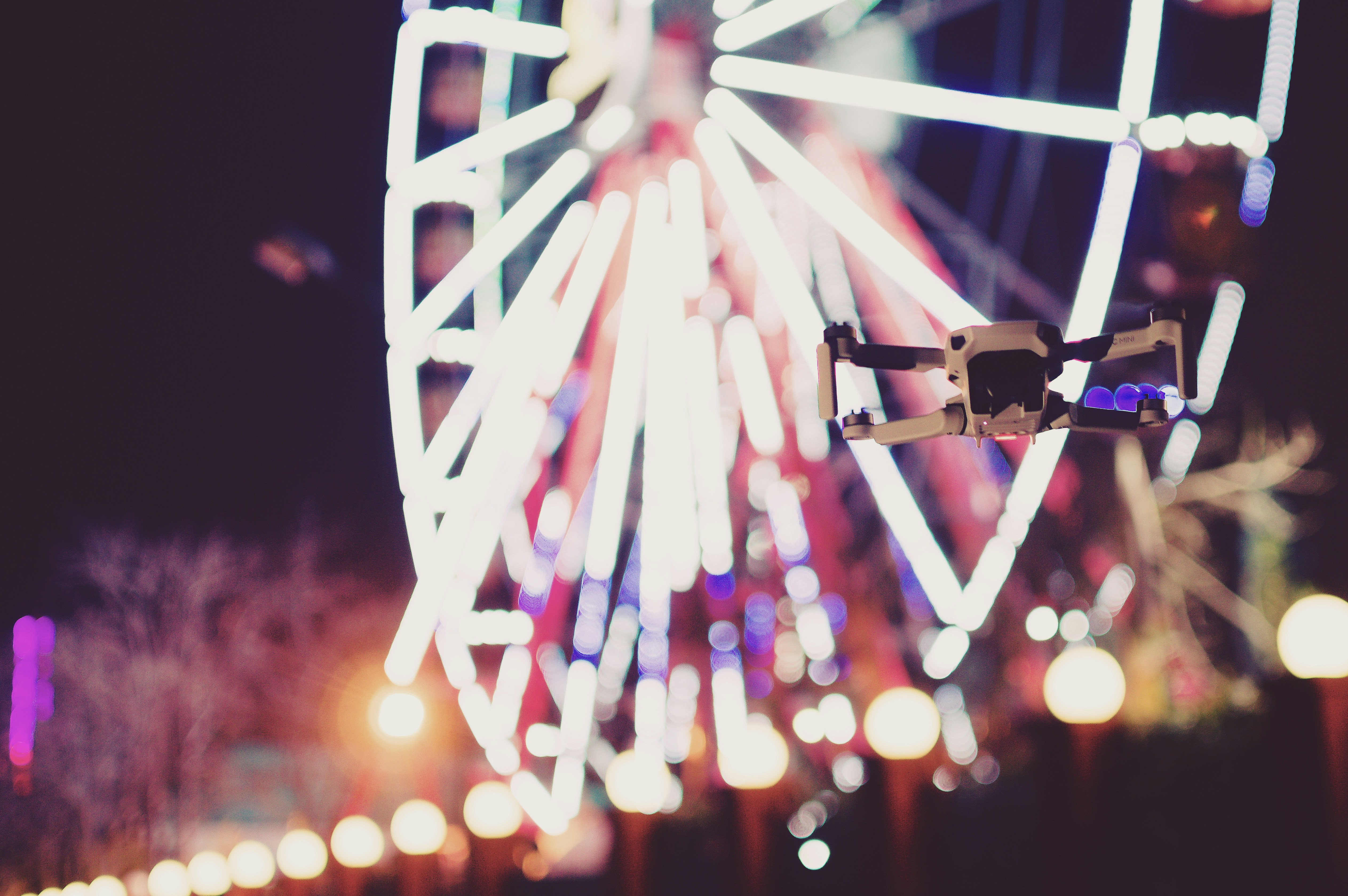 Dreamlike Neon Ferris Wheel in Soft Focus