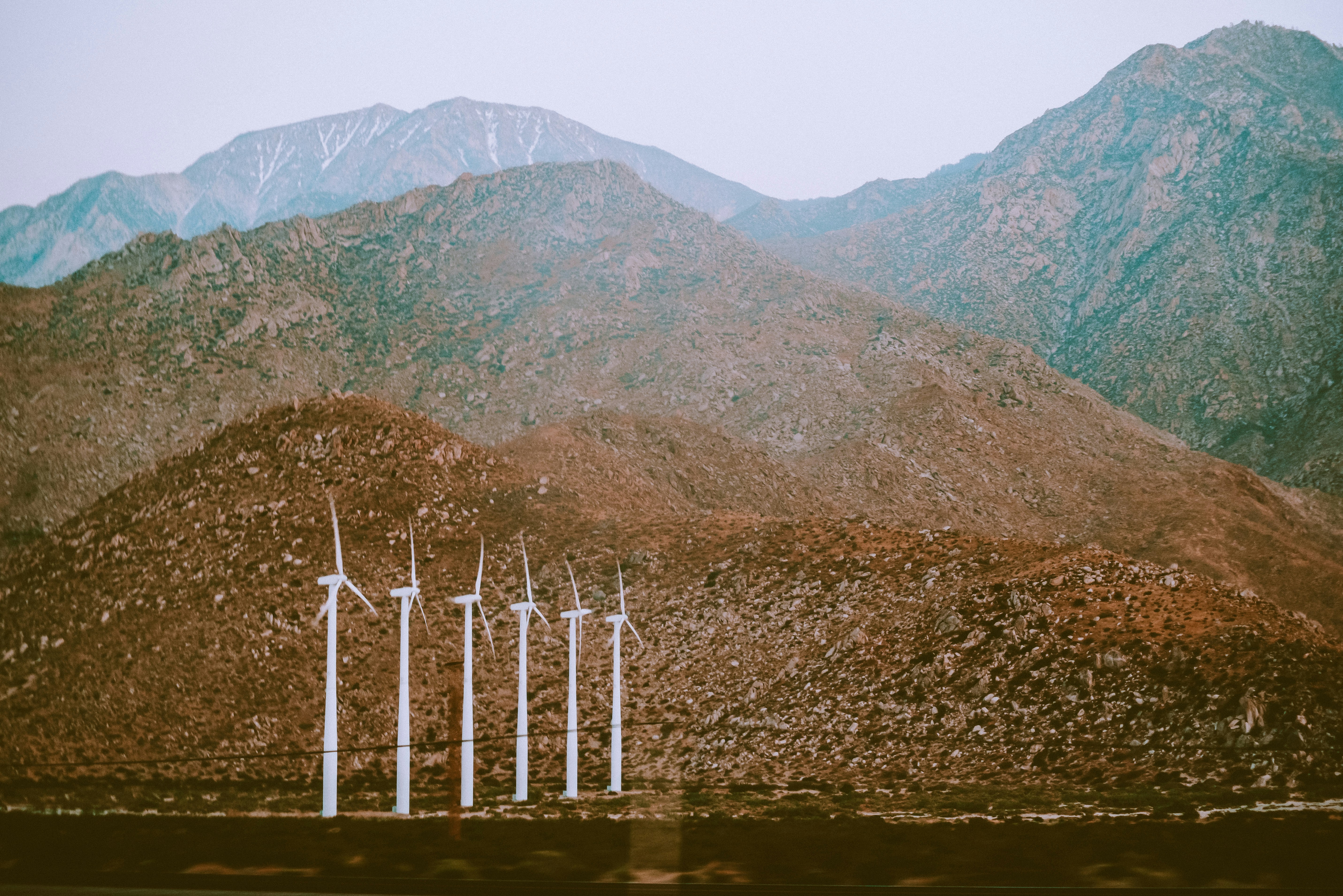 Wind turbines, electricity turbines, mountain side.