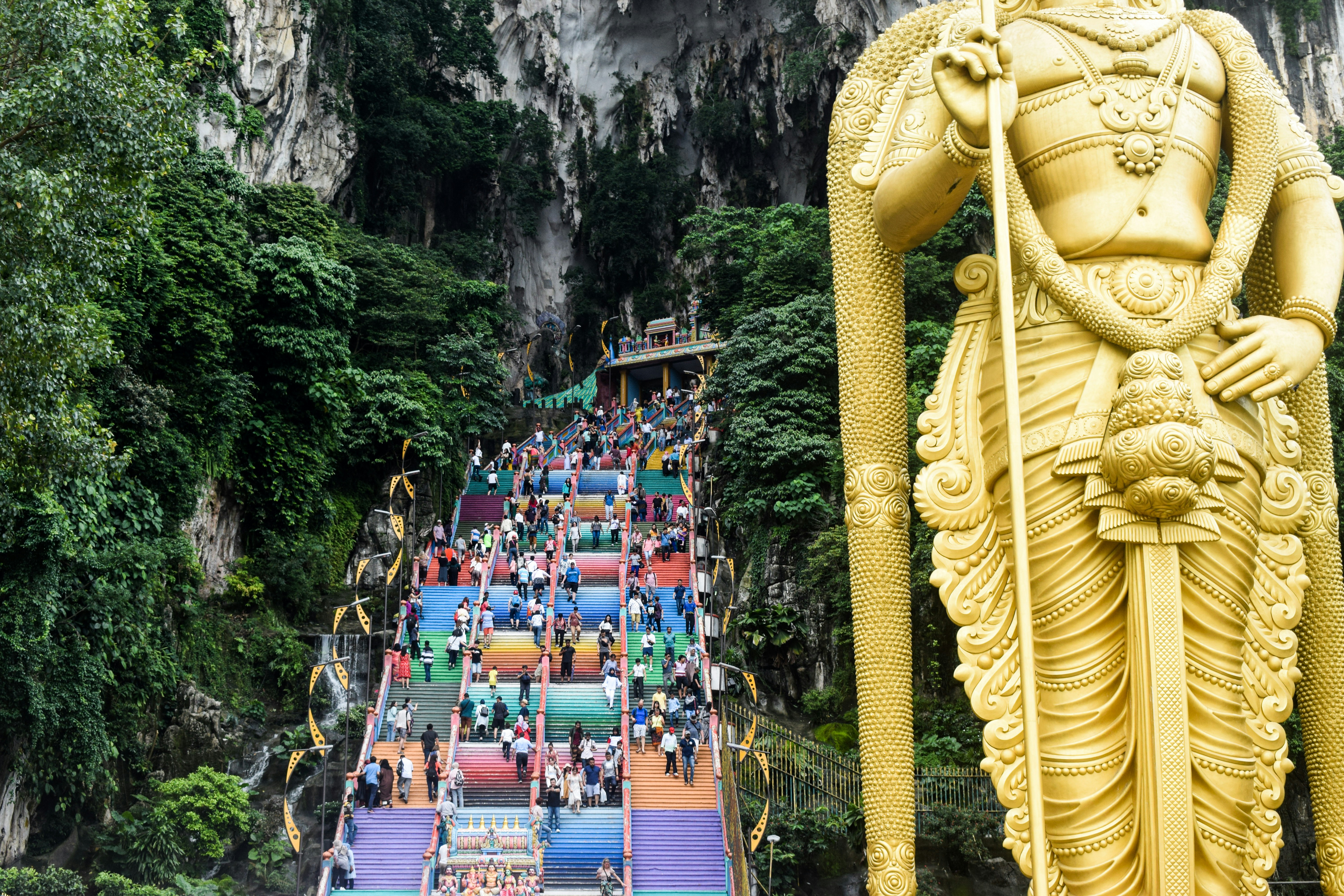 Rainbow Steps and a Golden Sentinel: Crowds Climb Batu Caves