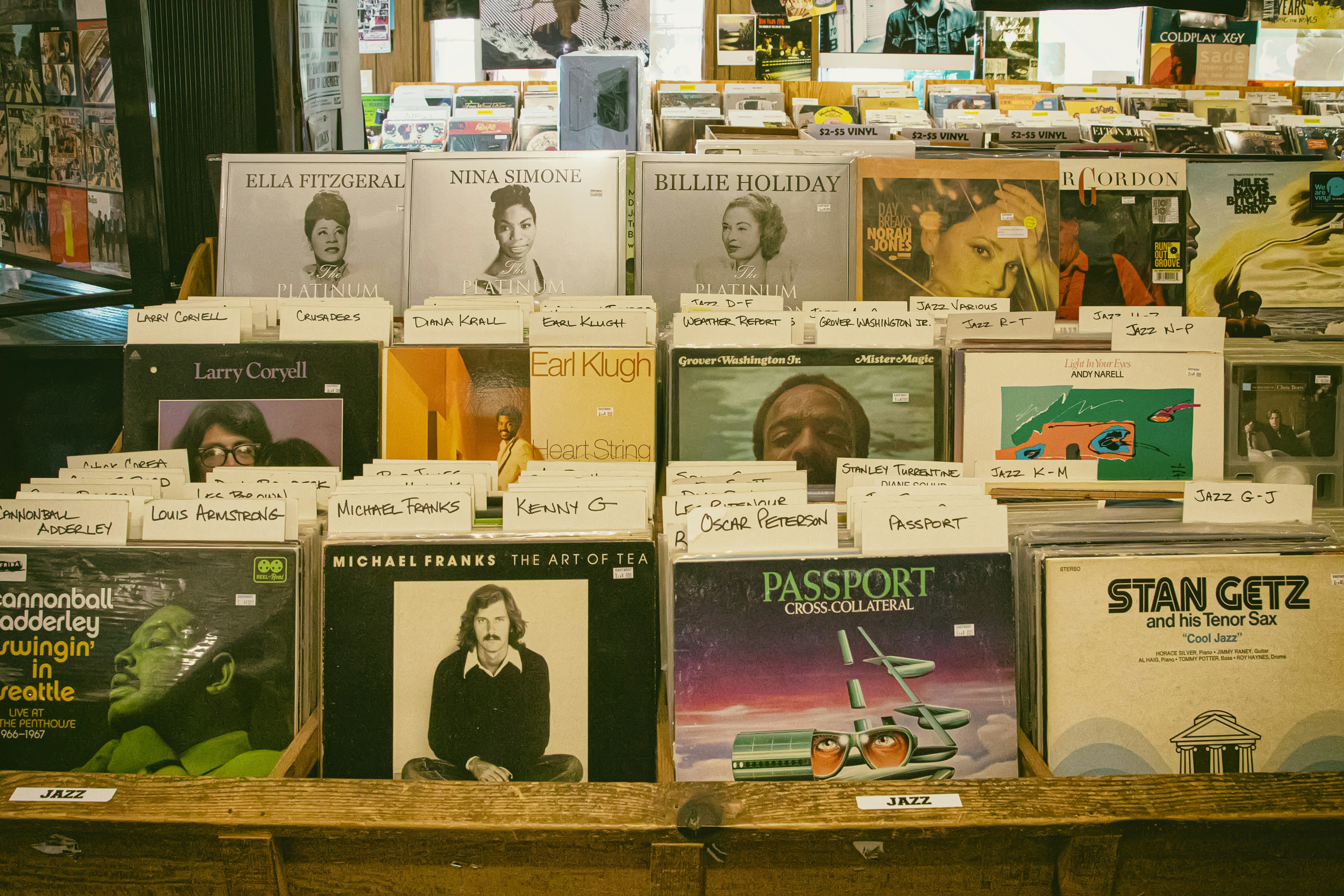 Records are so vintage...do that many people still buy records? I suppose so. Well I got the perfect store for you...East West Records, the oldest record store in Florida. | woman in black shirt beside woman in black shirt