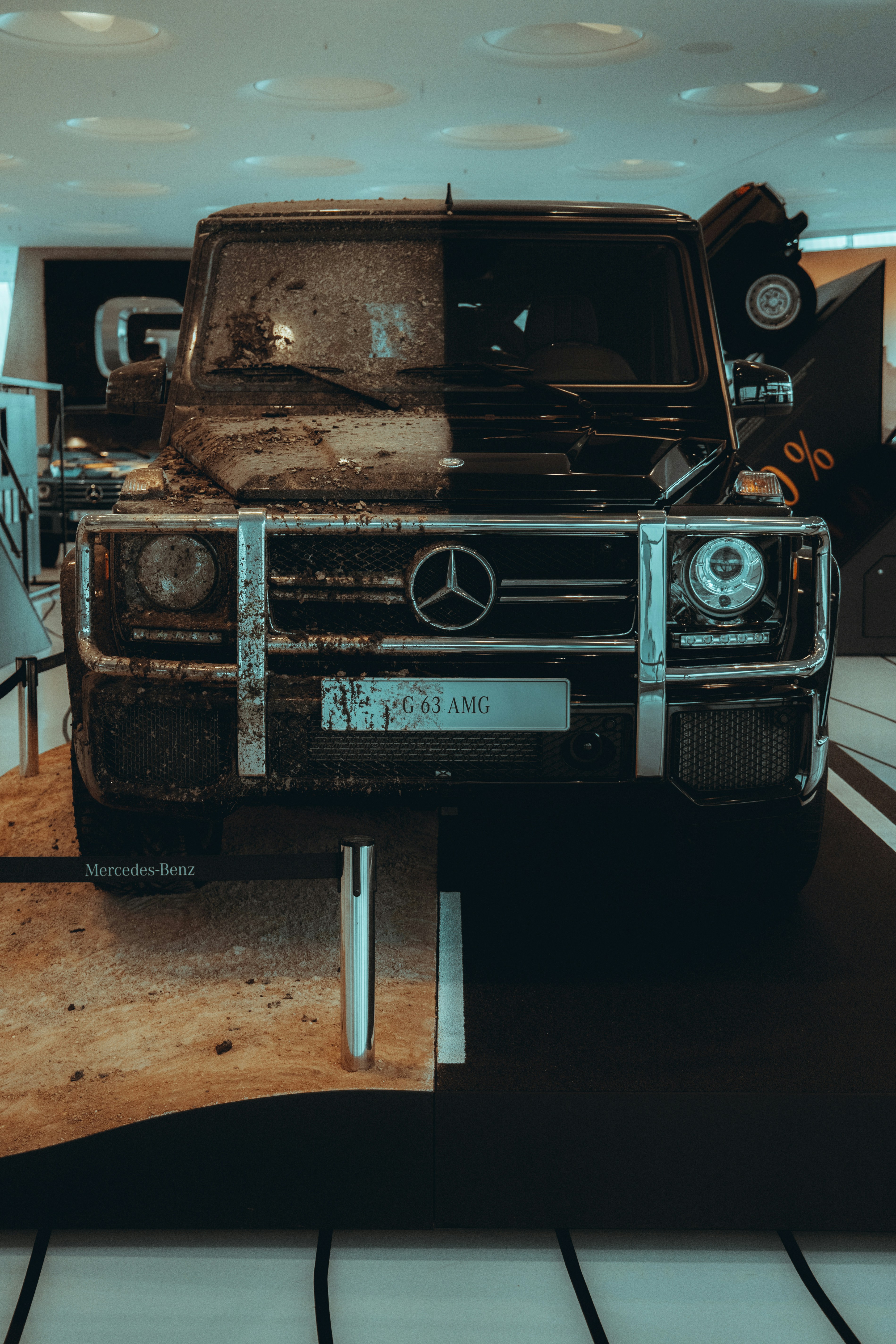 Mud-Splashed G63 AMG: Chrome Icon Under Studio Lights