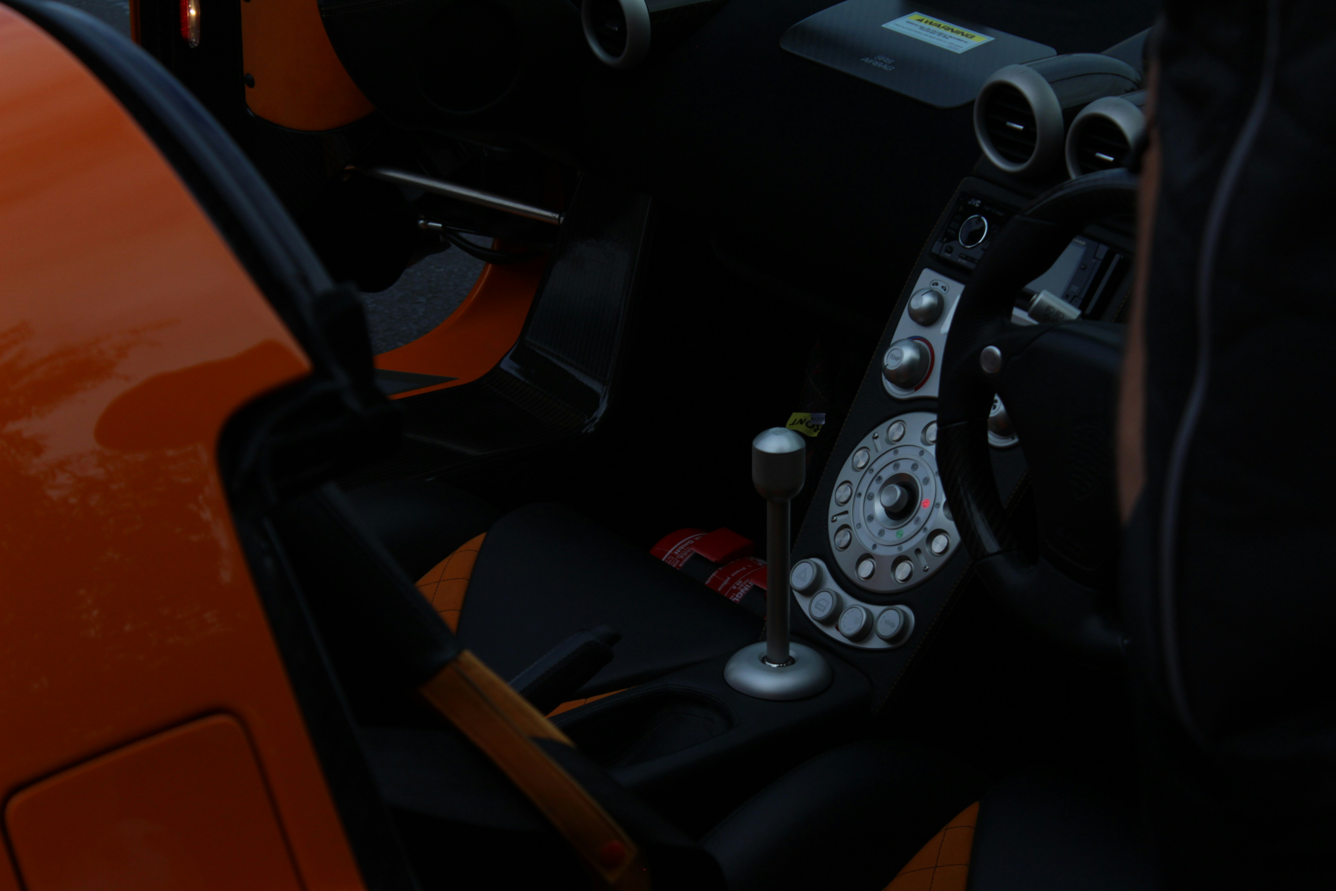 Torque in the Cockpit: Close-Up of an Orange Exotic Interior