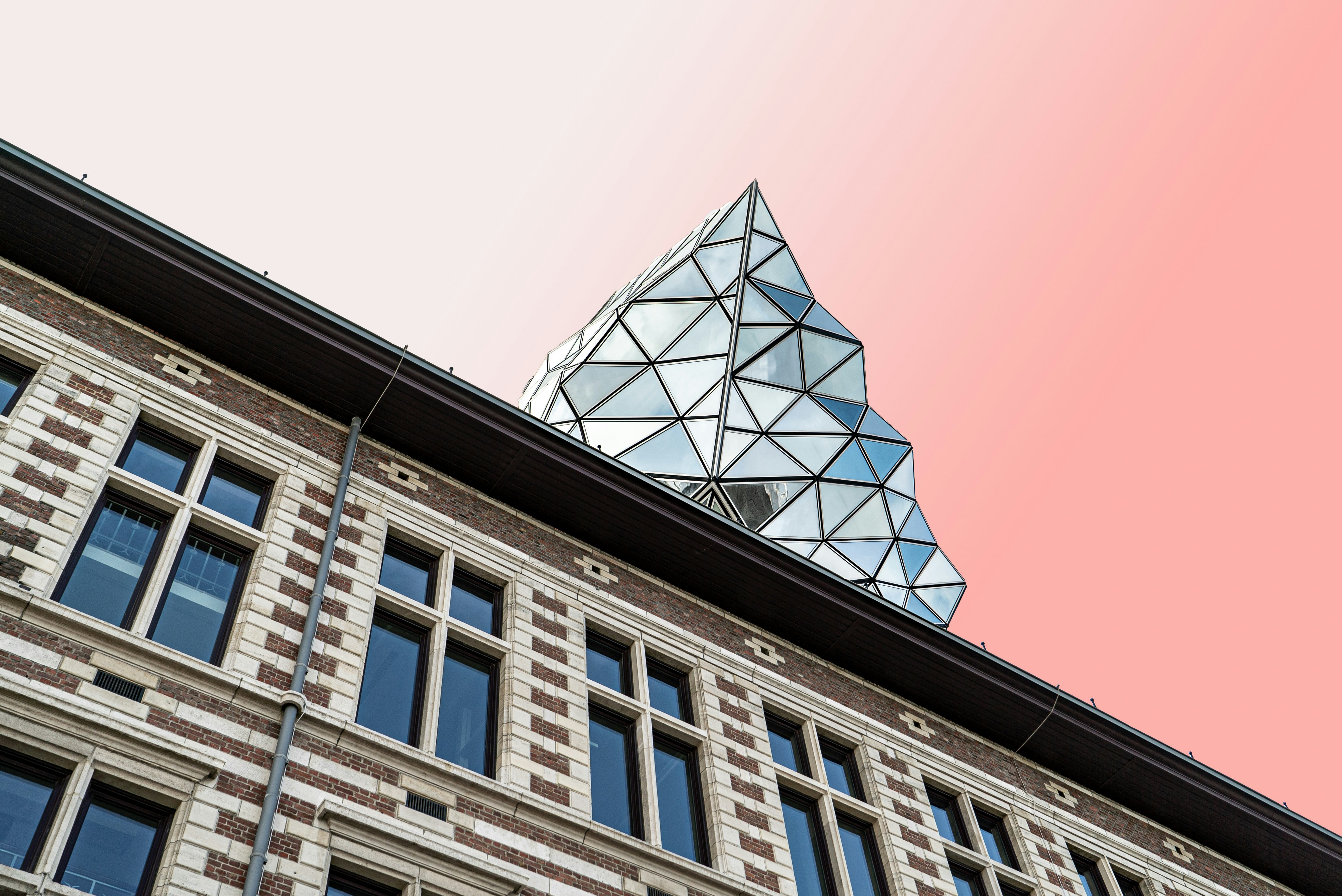 #GradientNation! 

The Antwerp Port Authority features a historic brick building, topped with a modern glass tile-shaped complex put on it. 