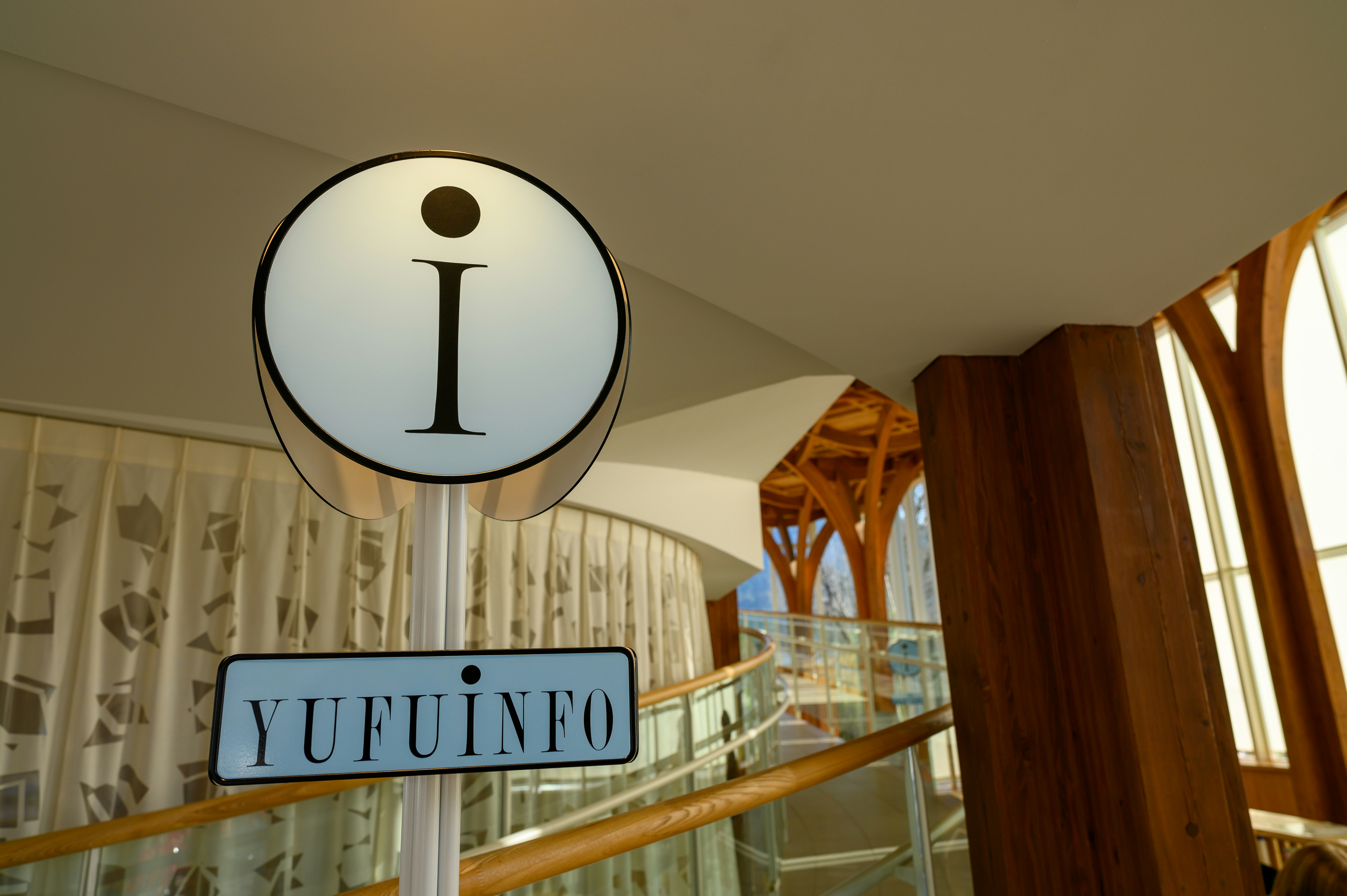 Iconic 'i' Sign with YUFUINFO Tag in Modern Interior