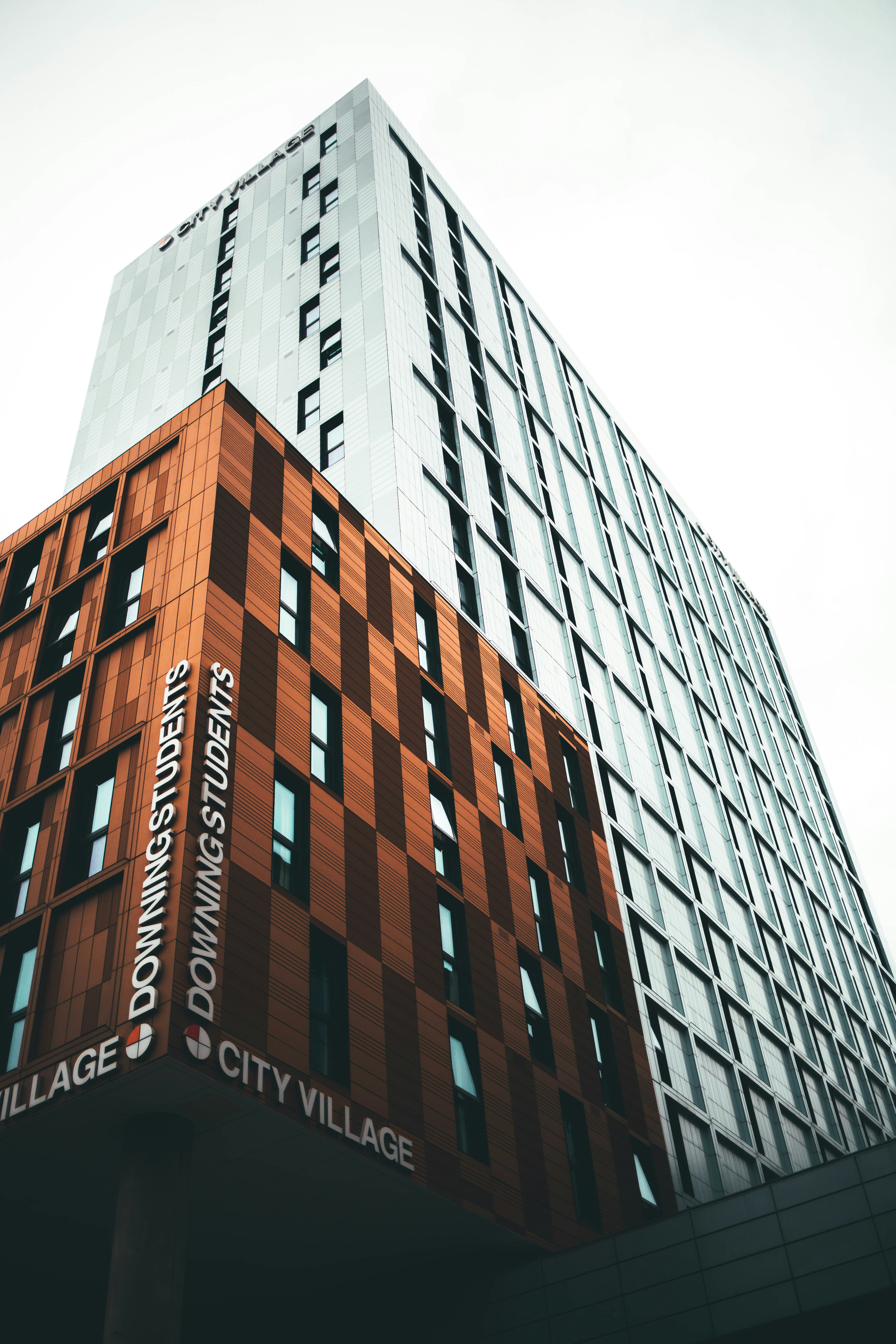Downing Students, City Village | brown and gray concrete building