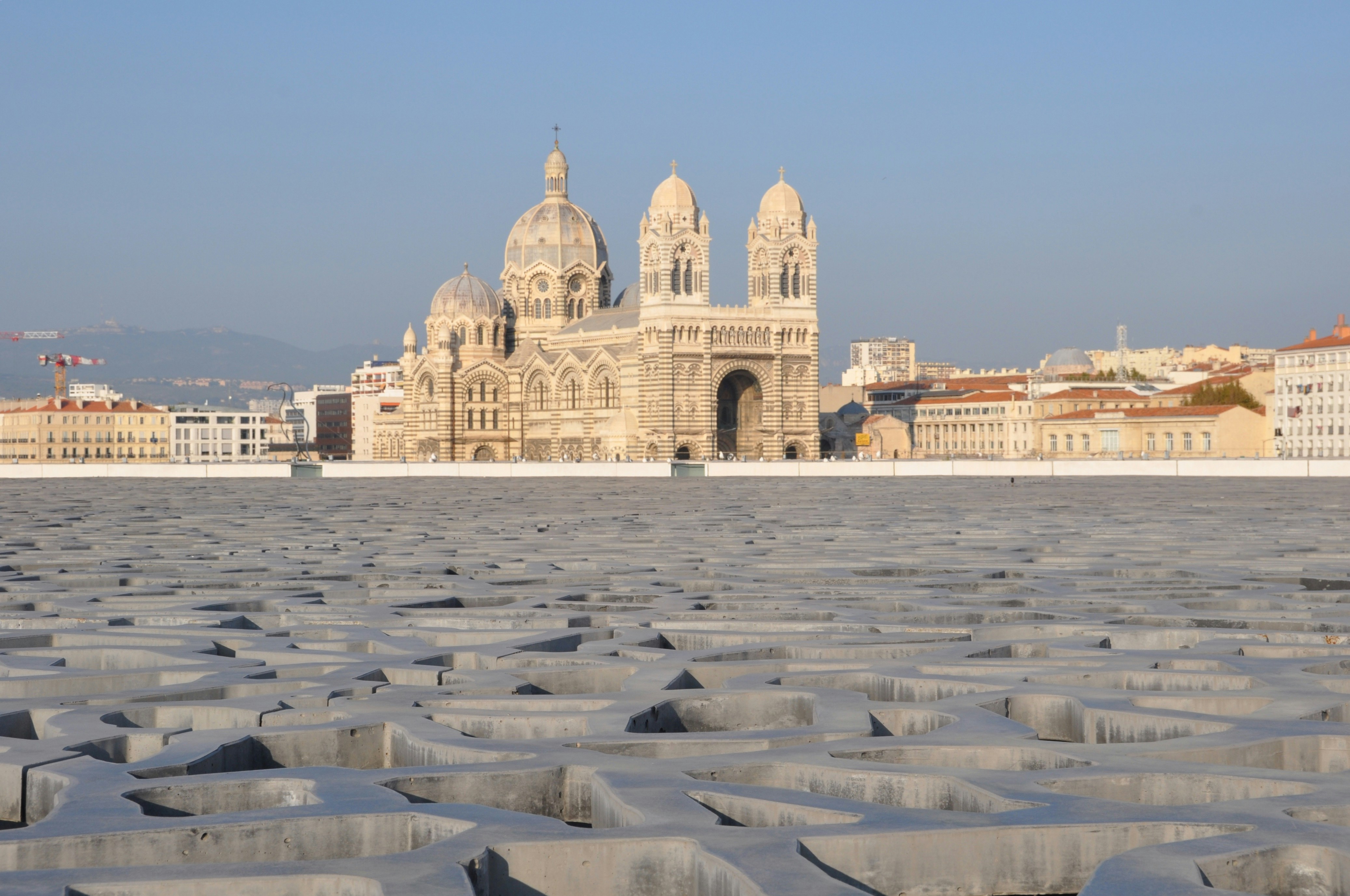 Granite Grid Recedes Toward a Baroque Cathedral