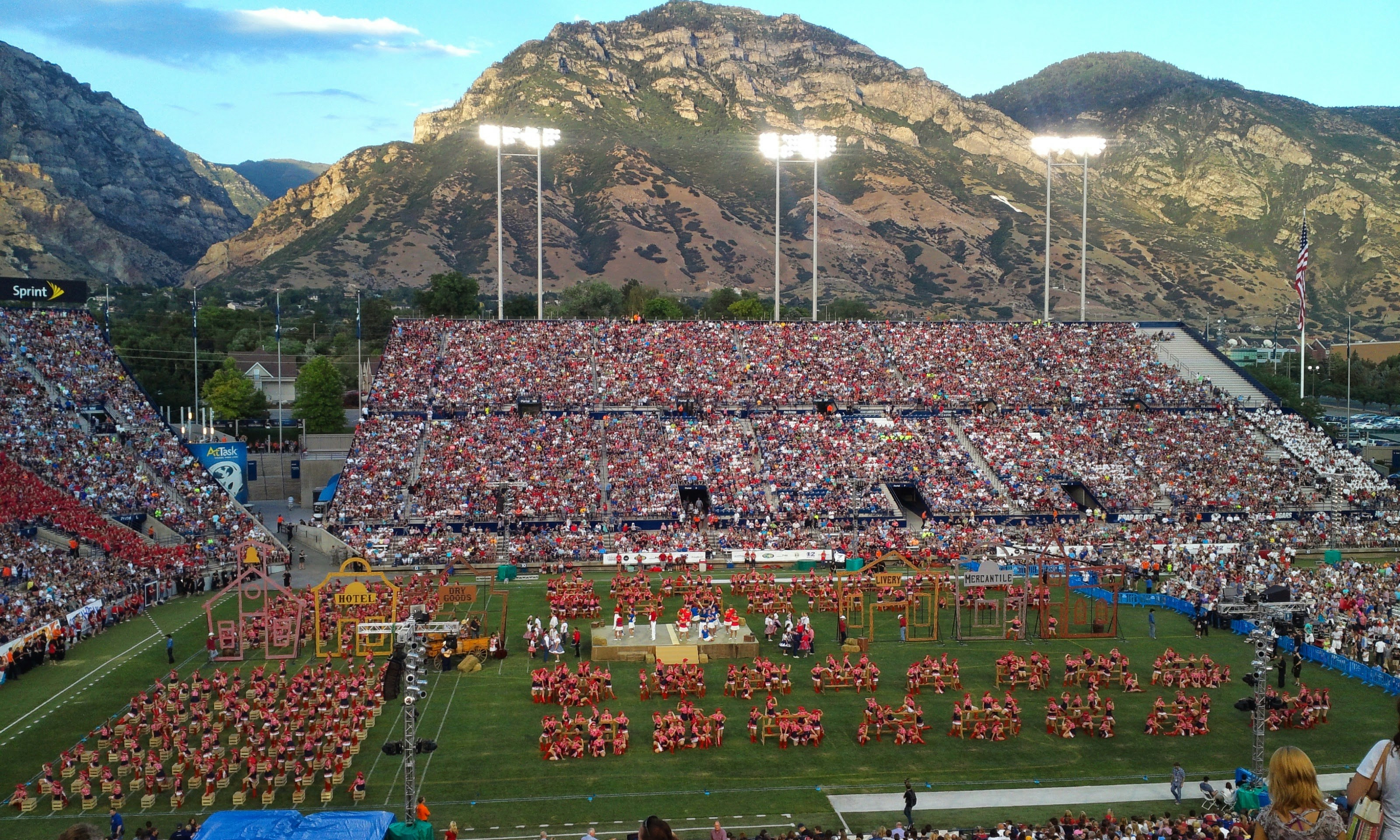 people on green grass field near mountain during daytime