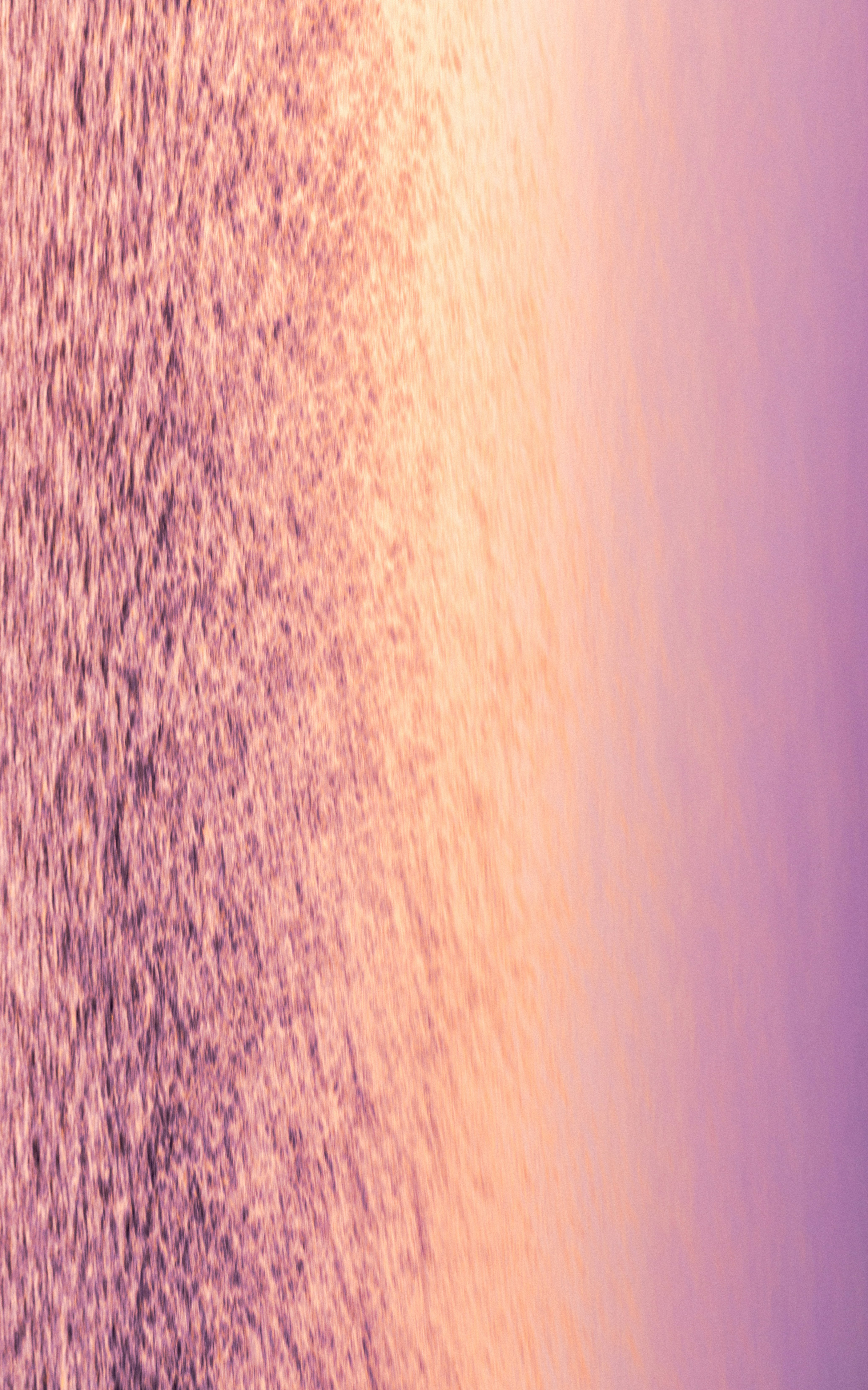 Abstract gradient of soft purples and warm tones blending seamlessly, evoking a sense of tranquility and dreaminess.