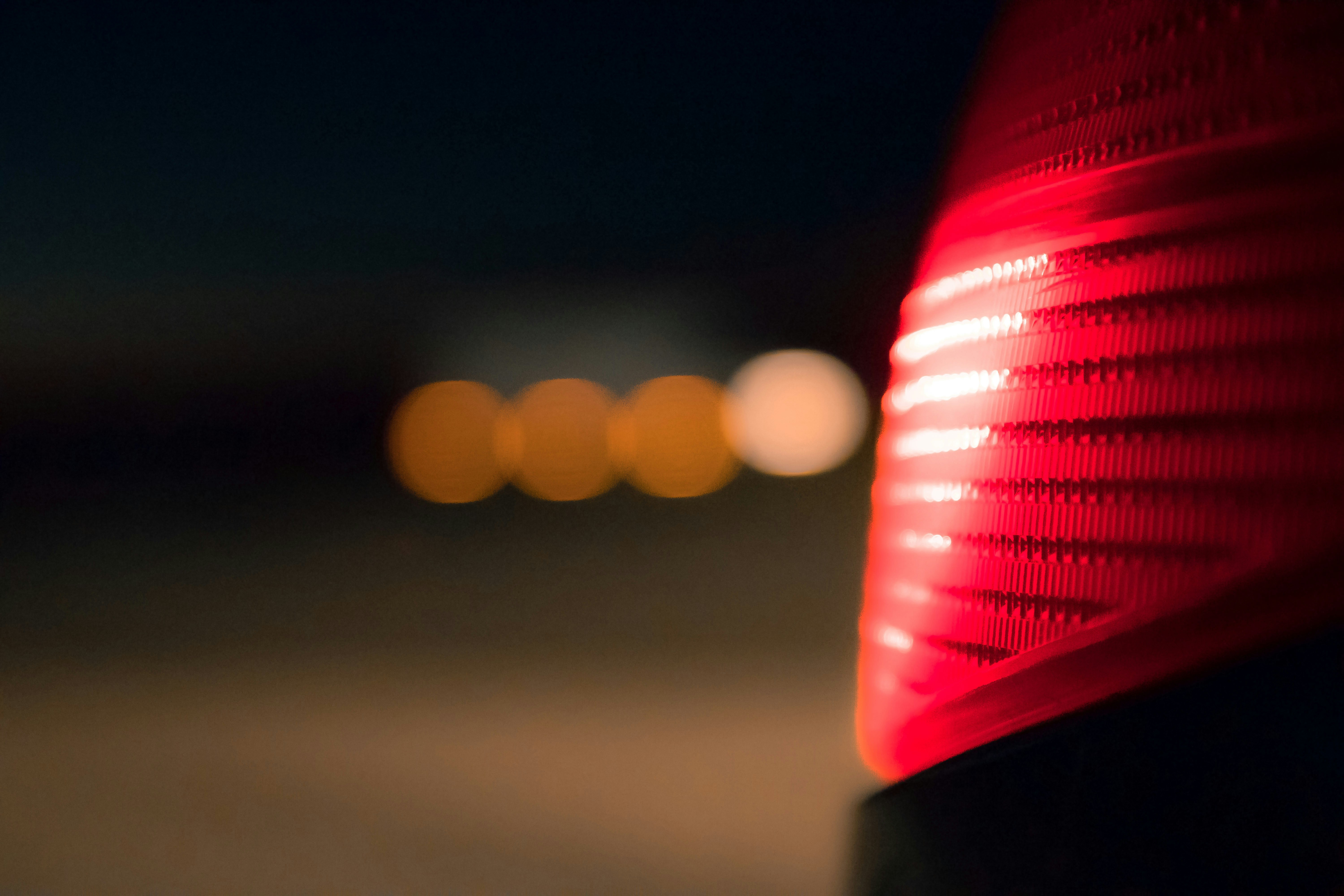 Red Beacon at Dusk: A Portrait of Bokeh and Quiet Motion