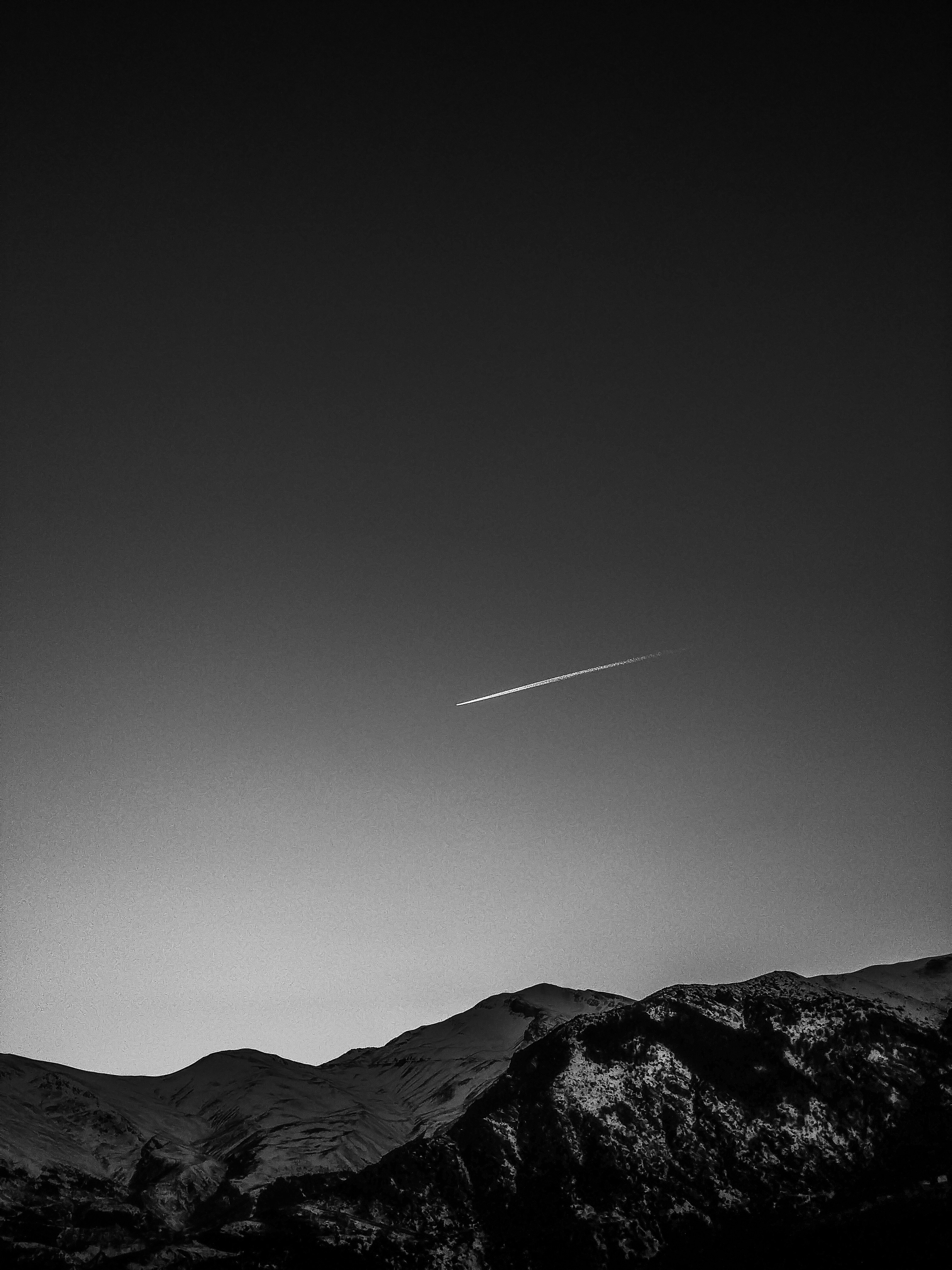 Grayscale photo of mountain range photo – Free Grey Image on Unsplash