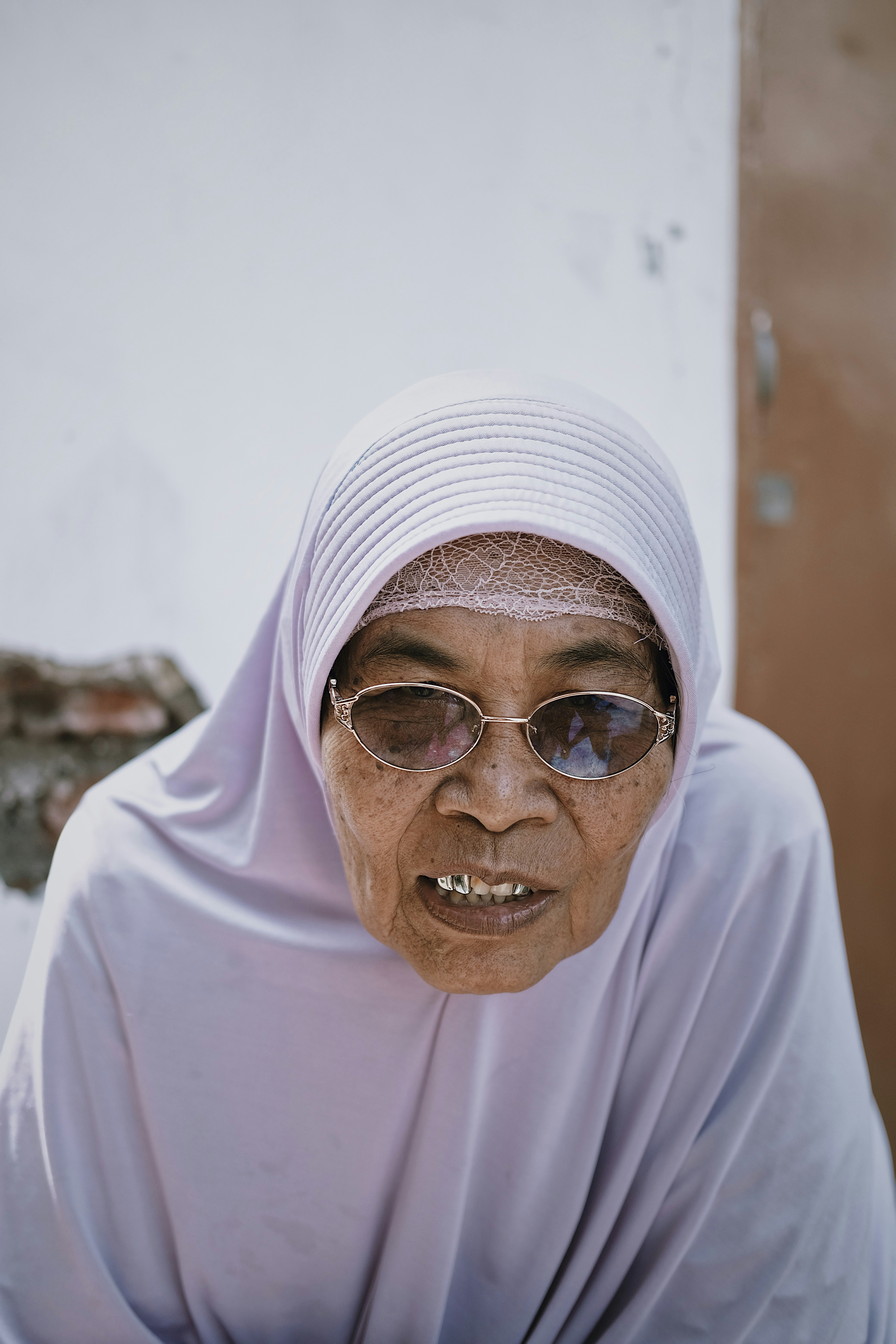 Lavender Veil, Quiet Gaze: Portrait at a Doorway