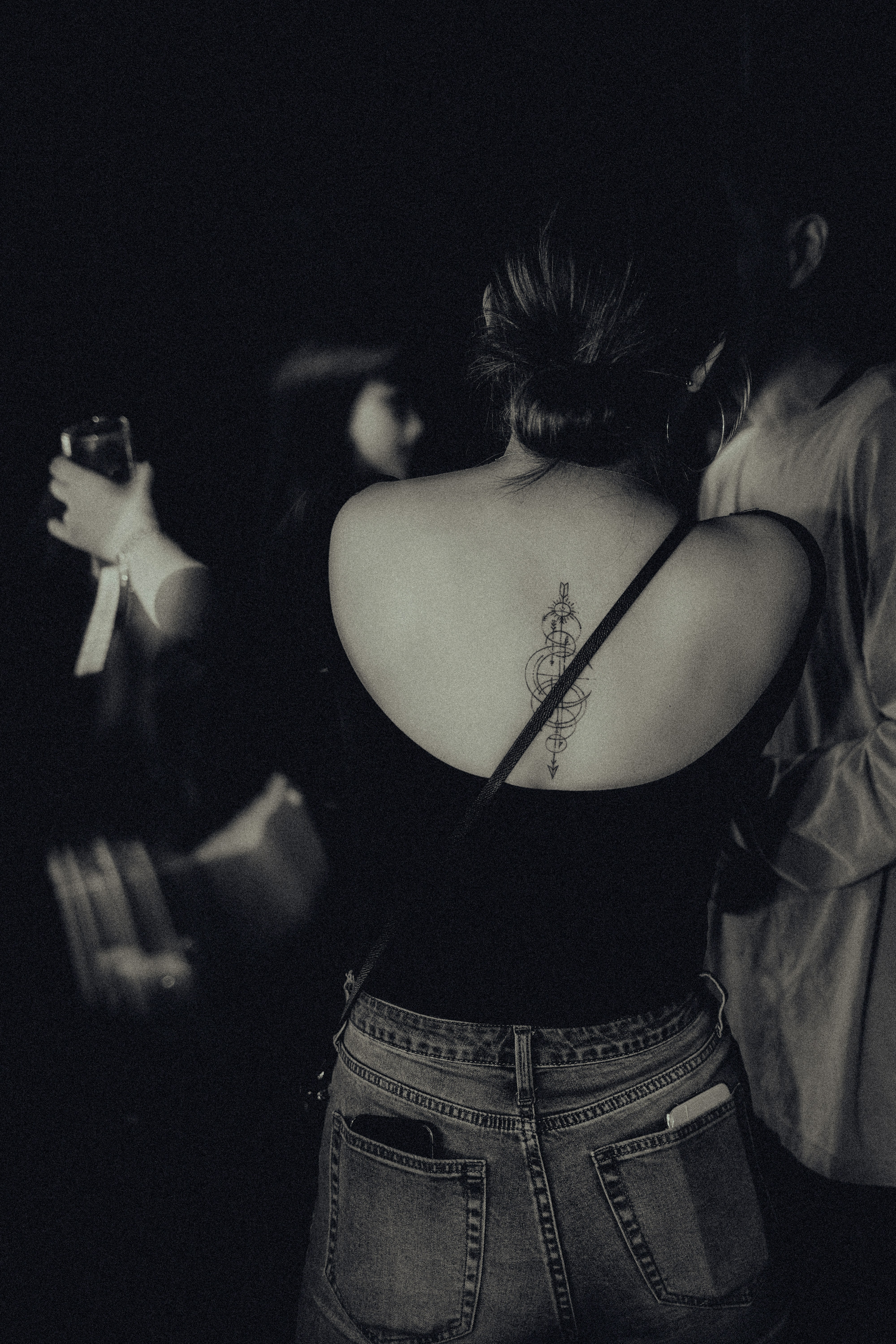 Midnight Tattooed Back: Subtle Portrait in the Crowd