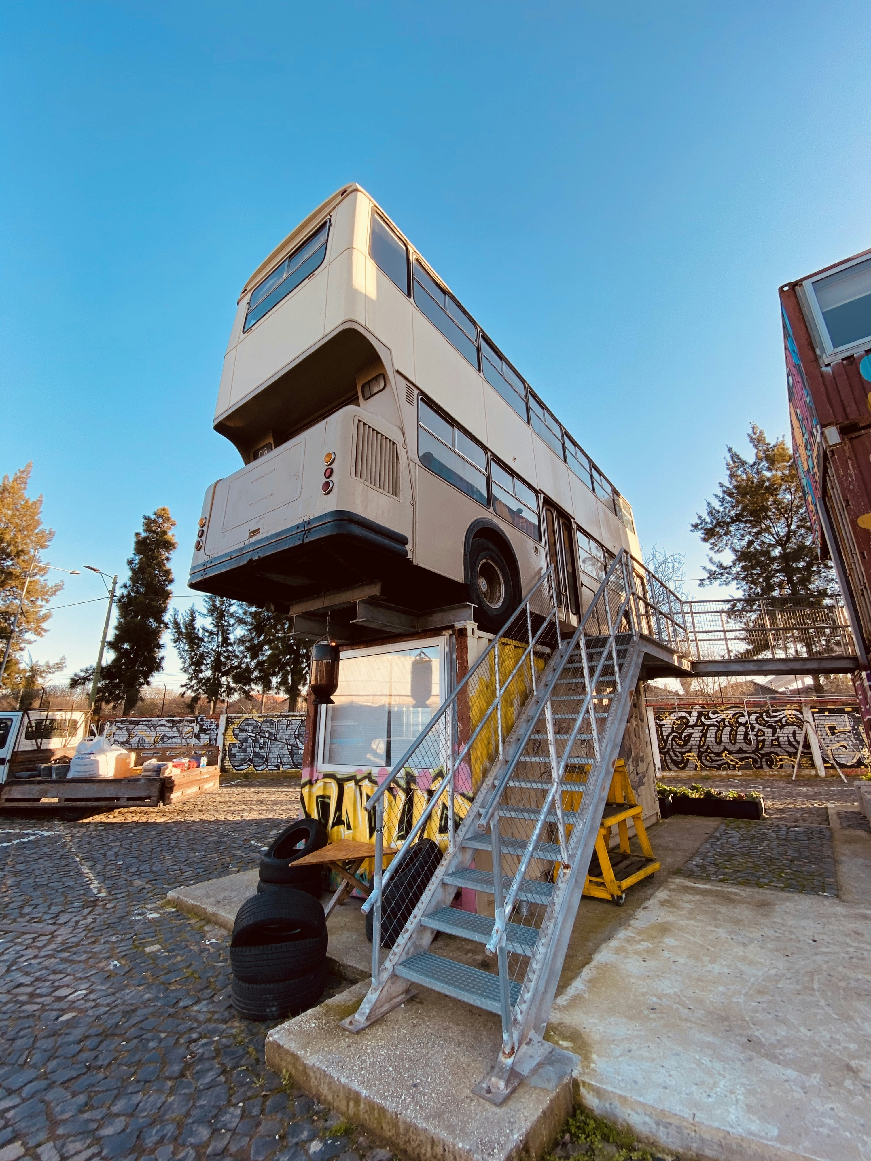 Upside-Down Historic Bus on Metal Staircase