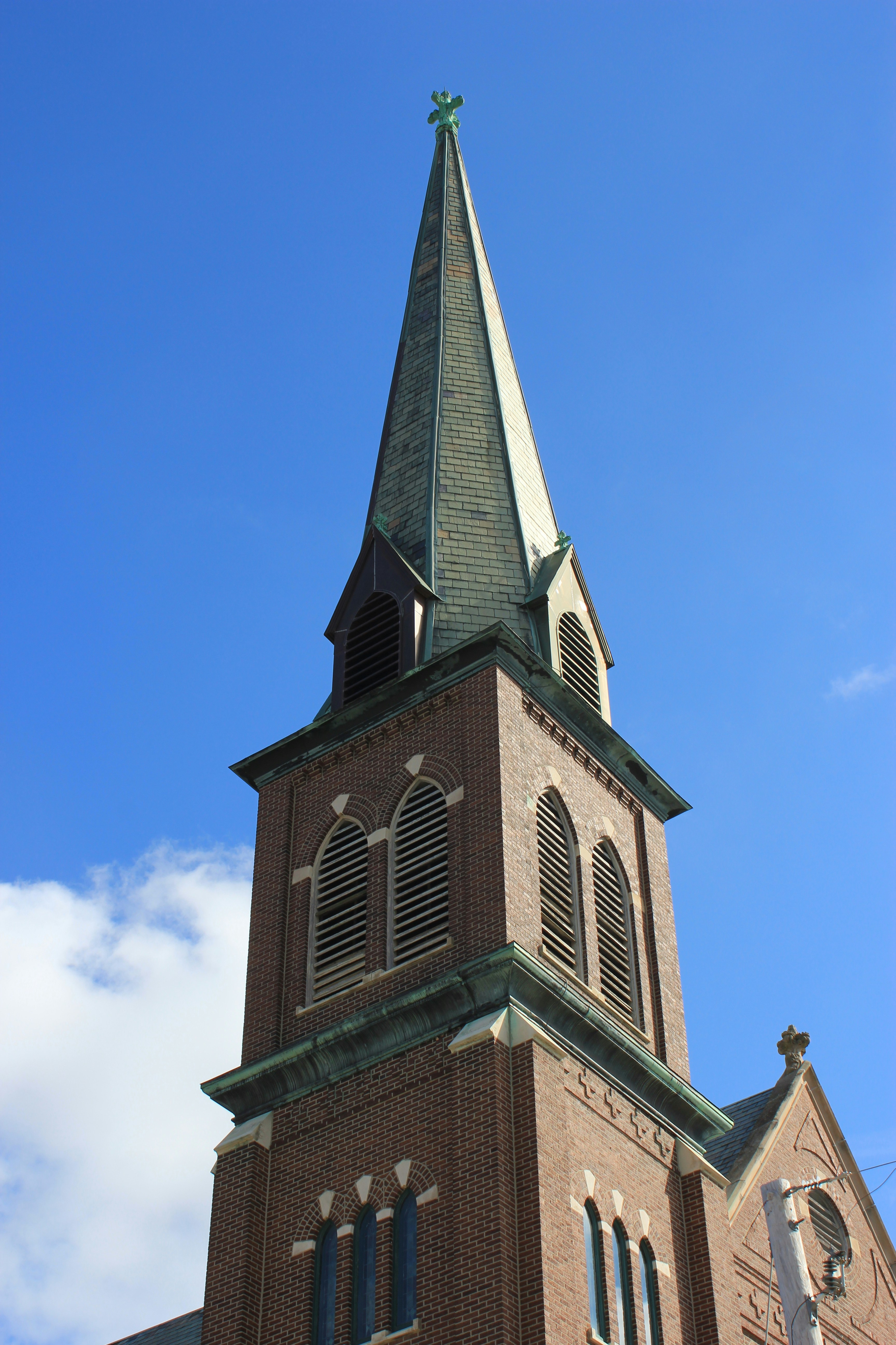 Brown and white concrete church under blue sky during daytime photo ...