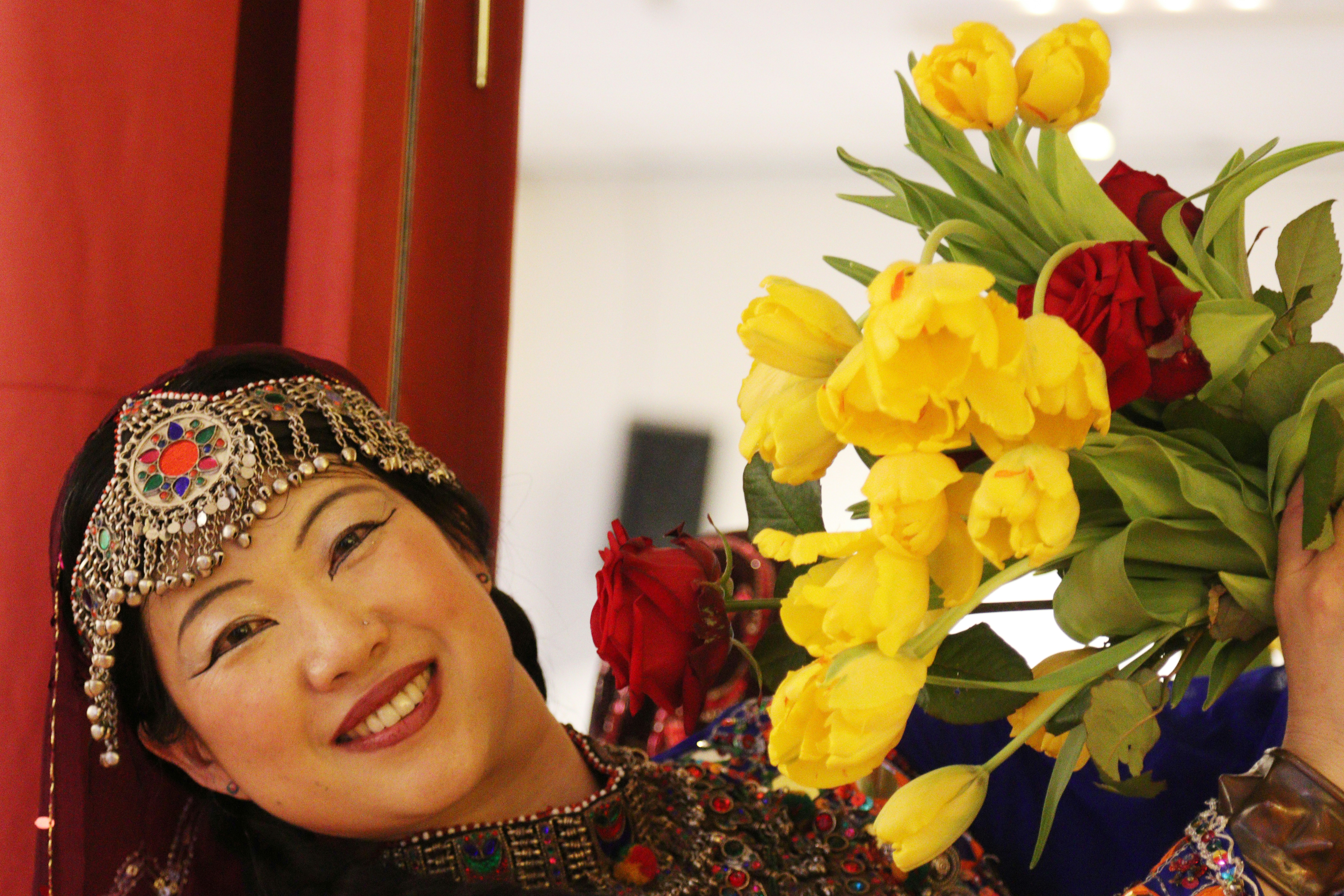 Joyful Portrait with Floral Accents at a Cultural Celebration