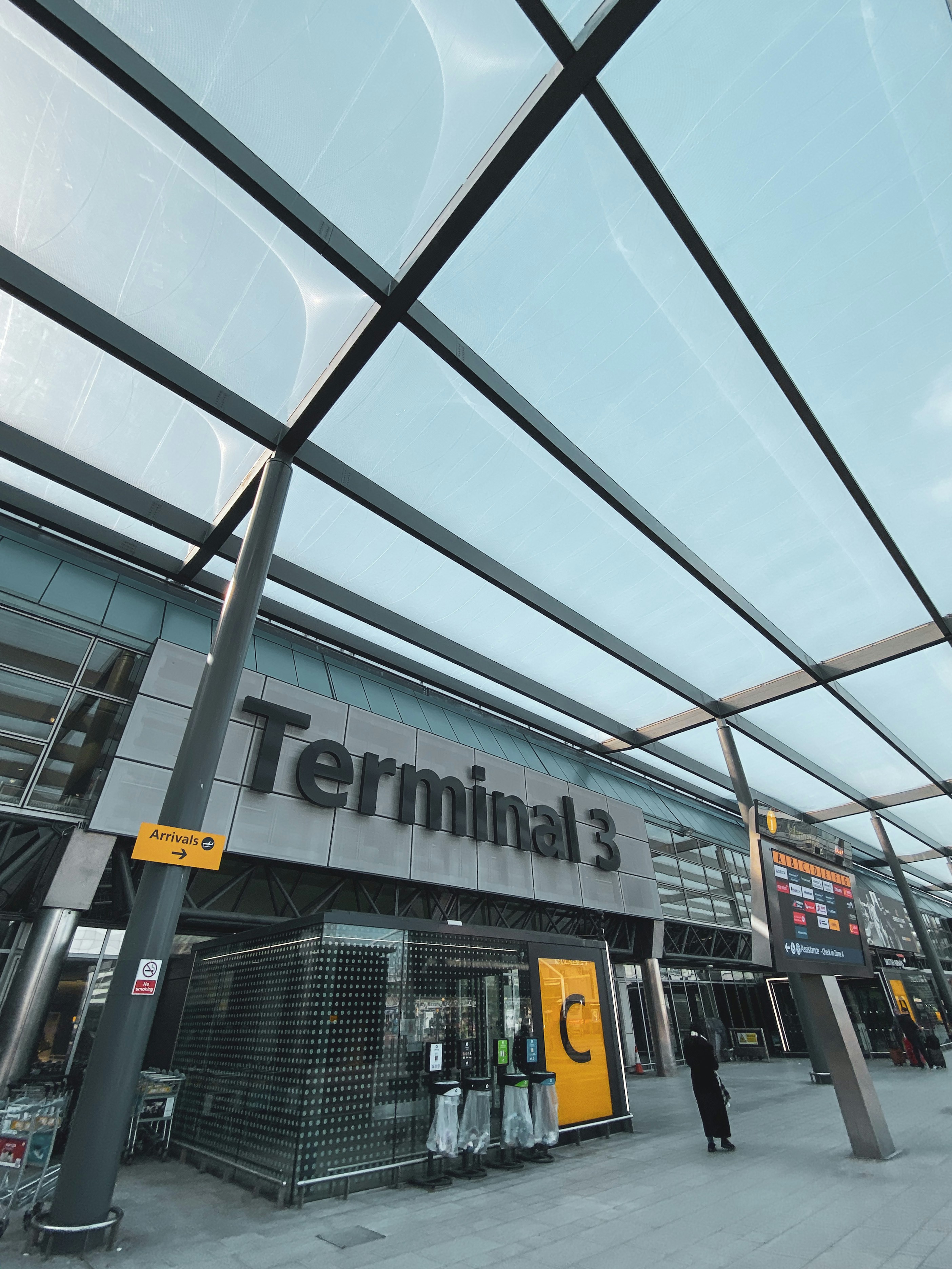 Glass Grid Over Terminal 3: Lines, Light, and a Quiet Entrance