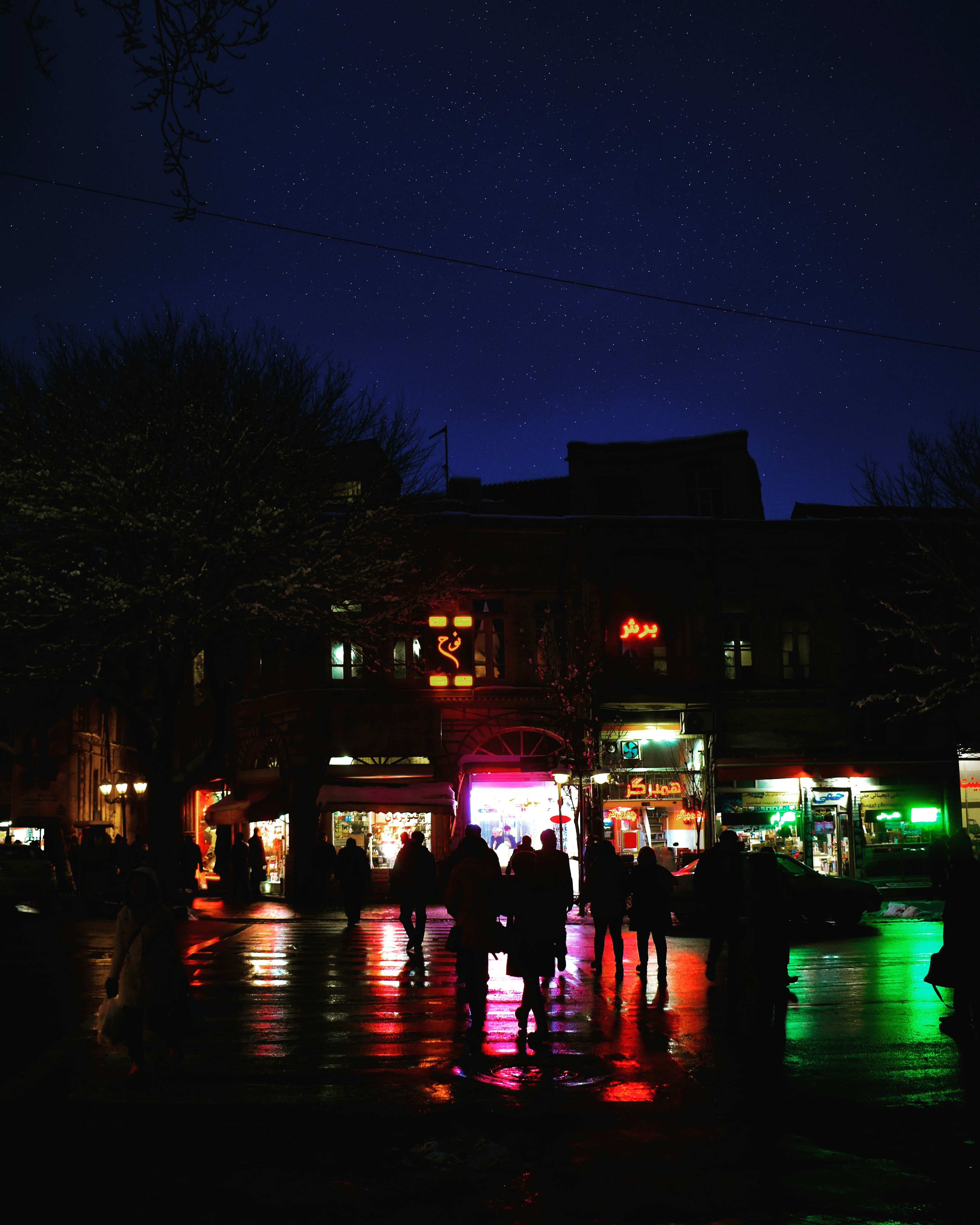 People walking on street during night time photo – Free Iran Image on ...