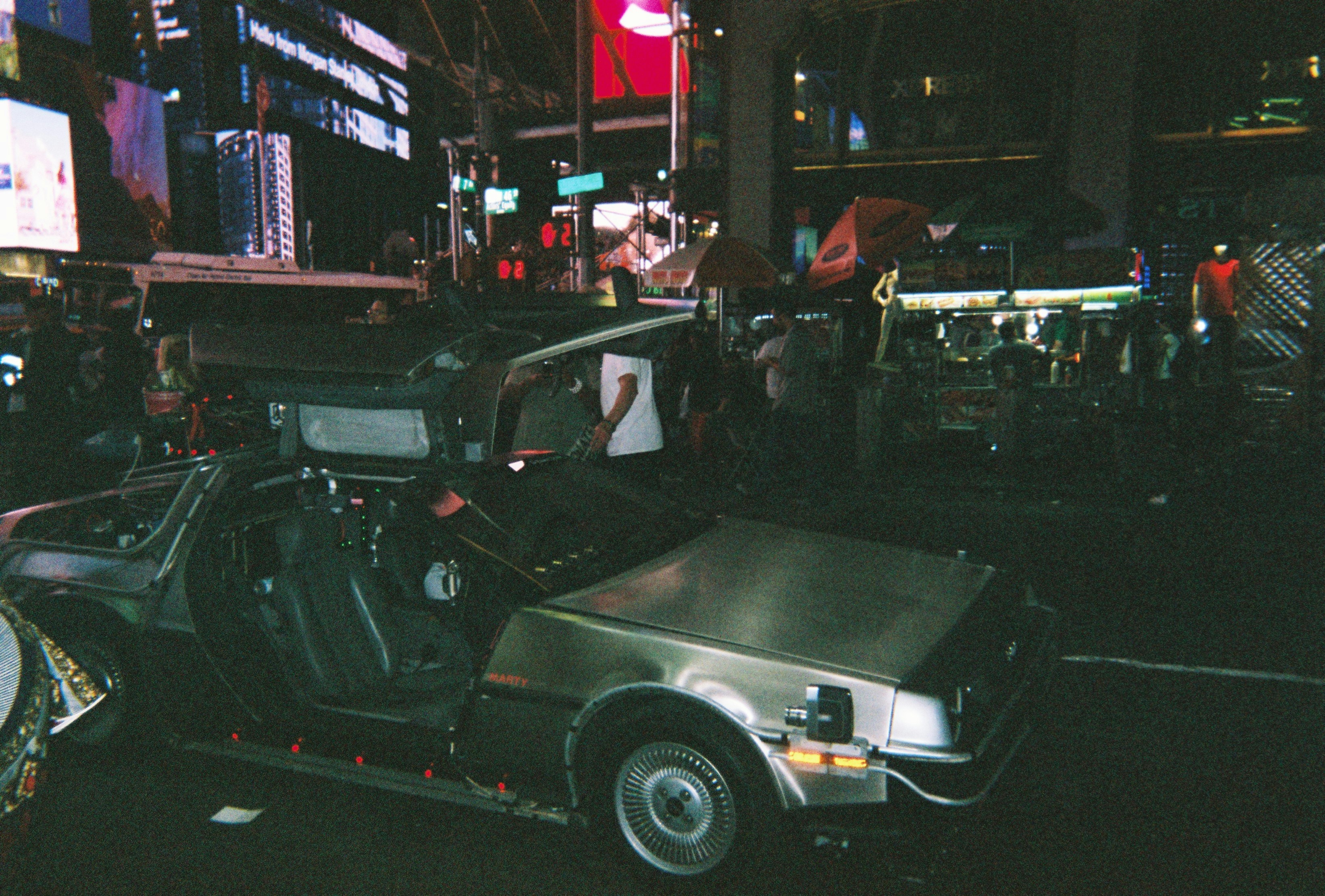 Neon Gull-Wings: a DeLorean Resting in Midnight City