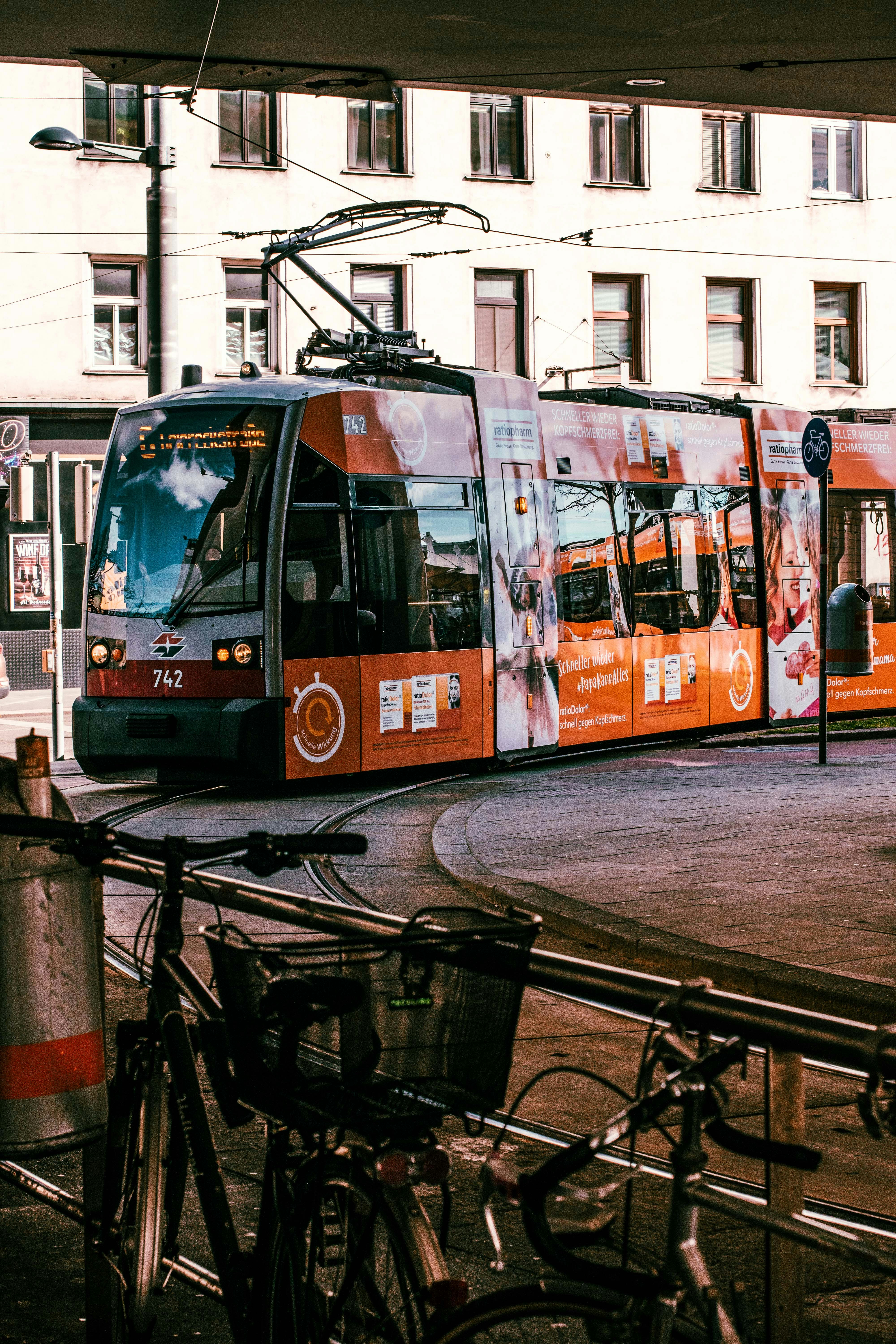 Orange and white tram on road during daytime photo – Free Austria Image ...