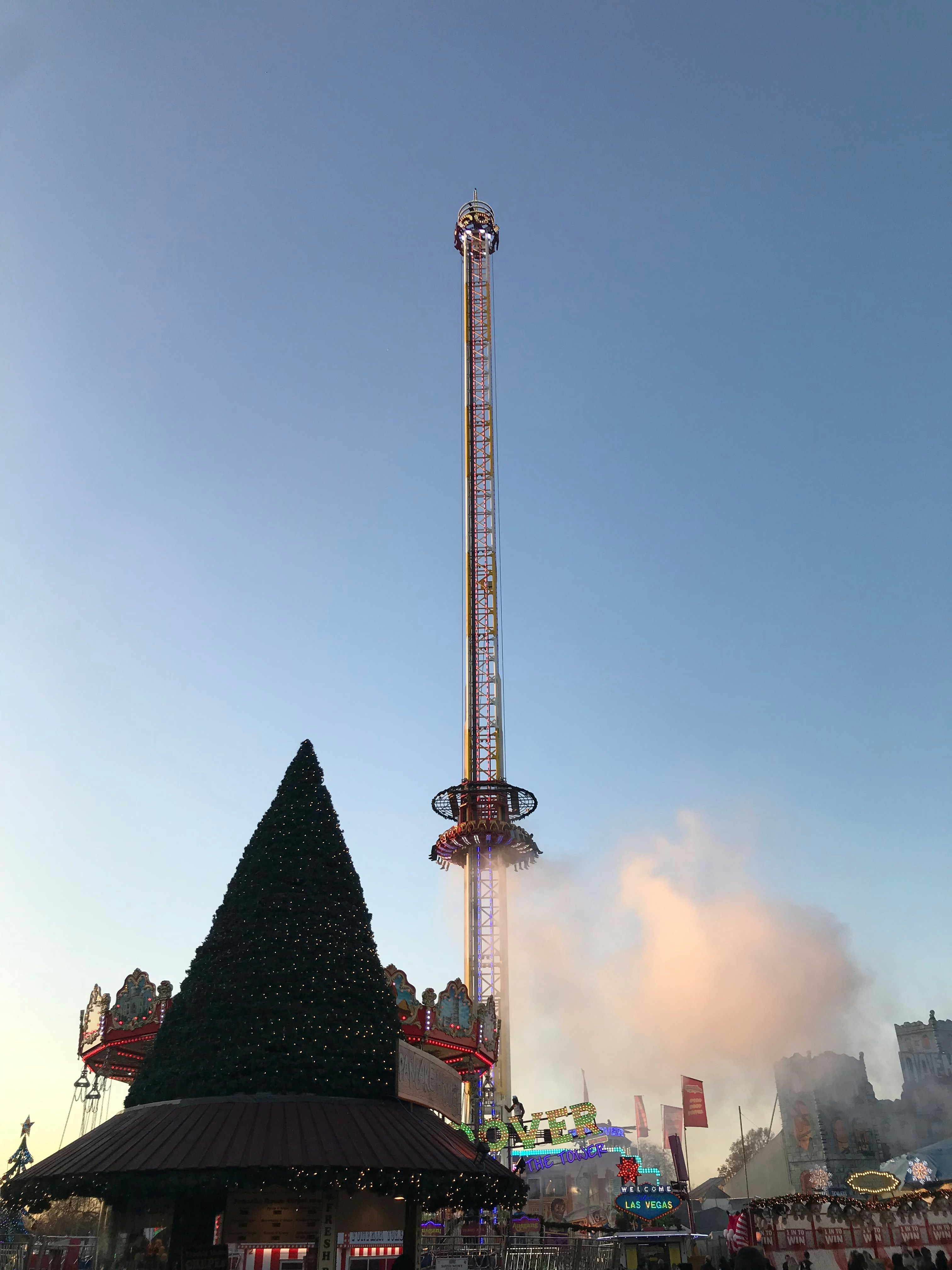 white and red tower under gray sky