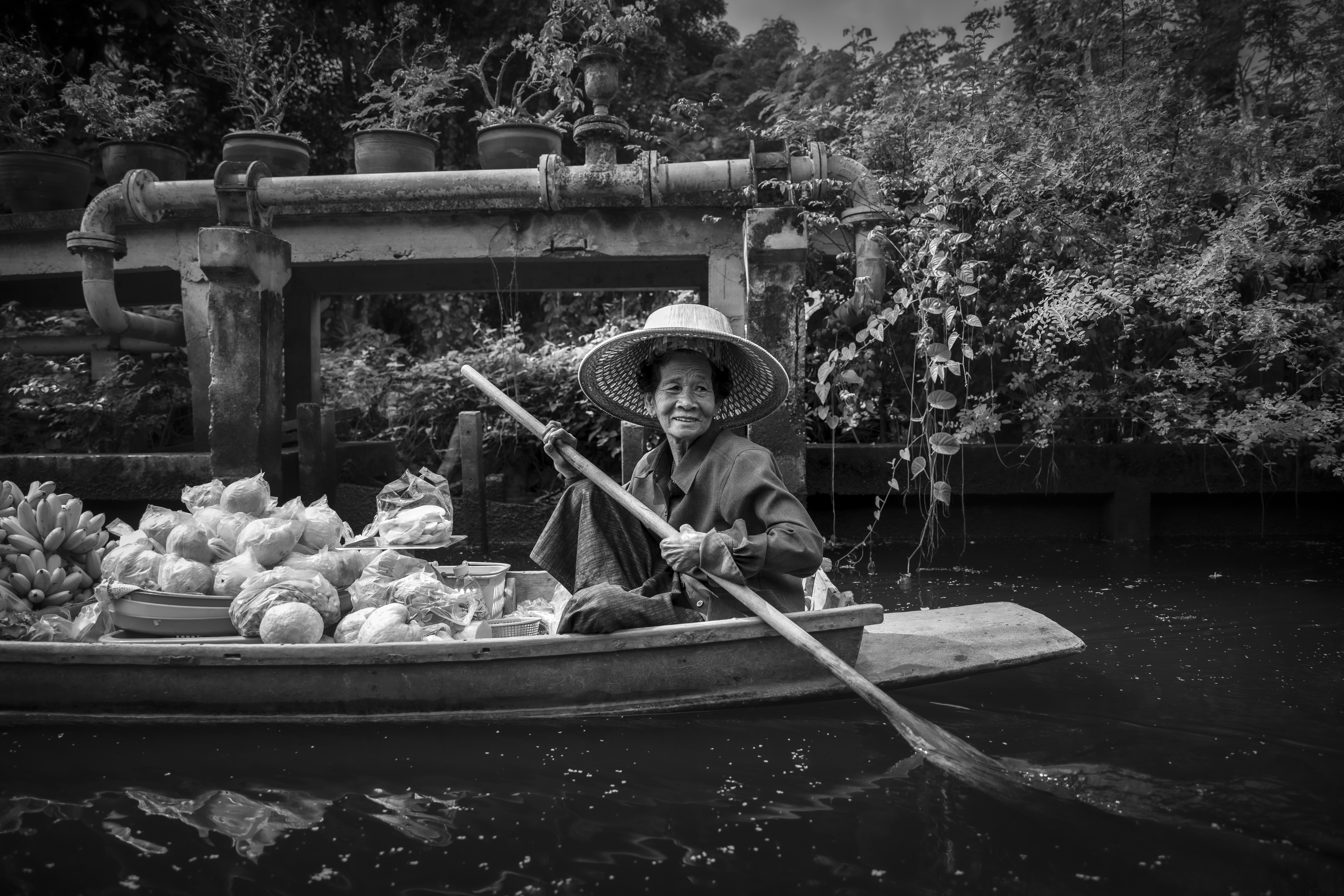 River Boat Vendor in Quiet Monochrome