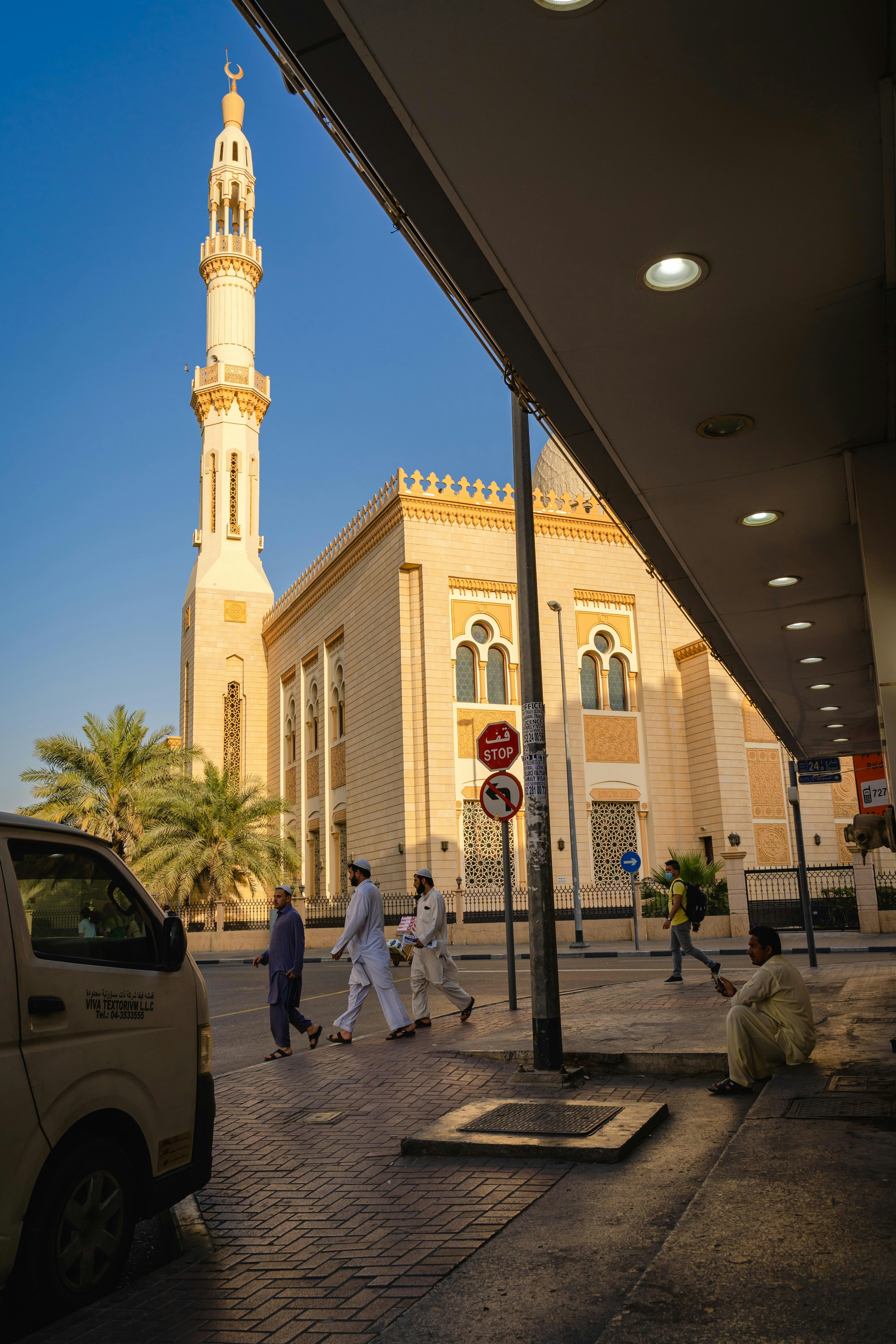 Golden Hour Minaret: Palm-Framed Mosque Street