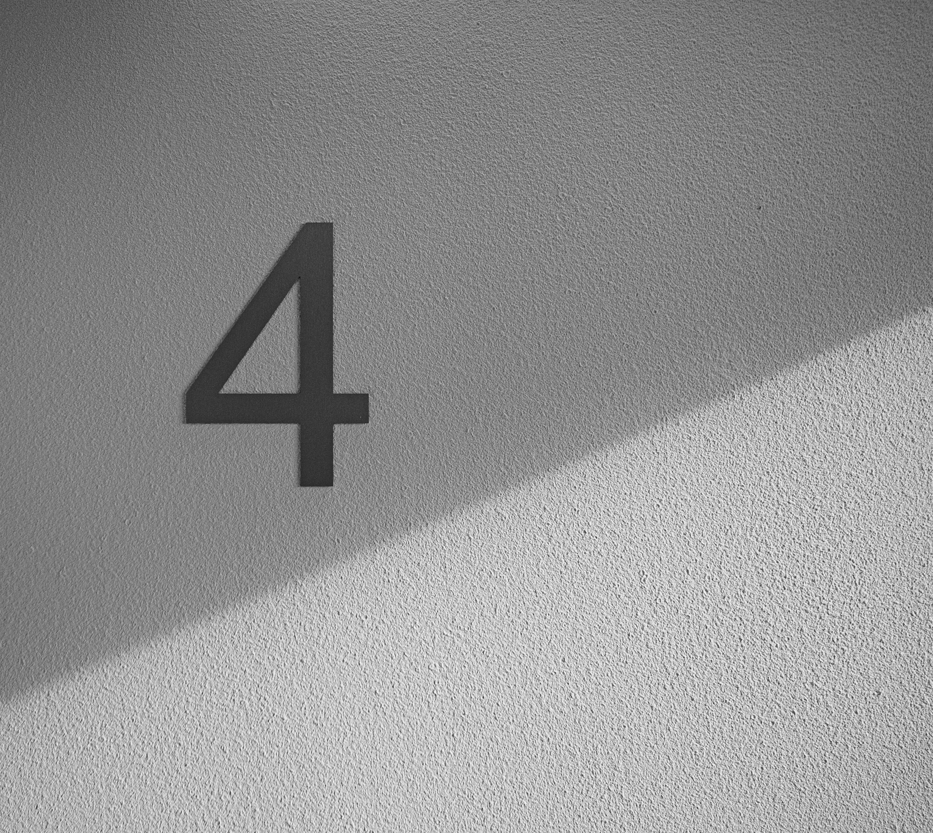 Four in the Fold: Light and Shadow on a Textured Wall