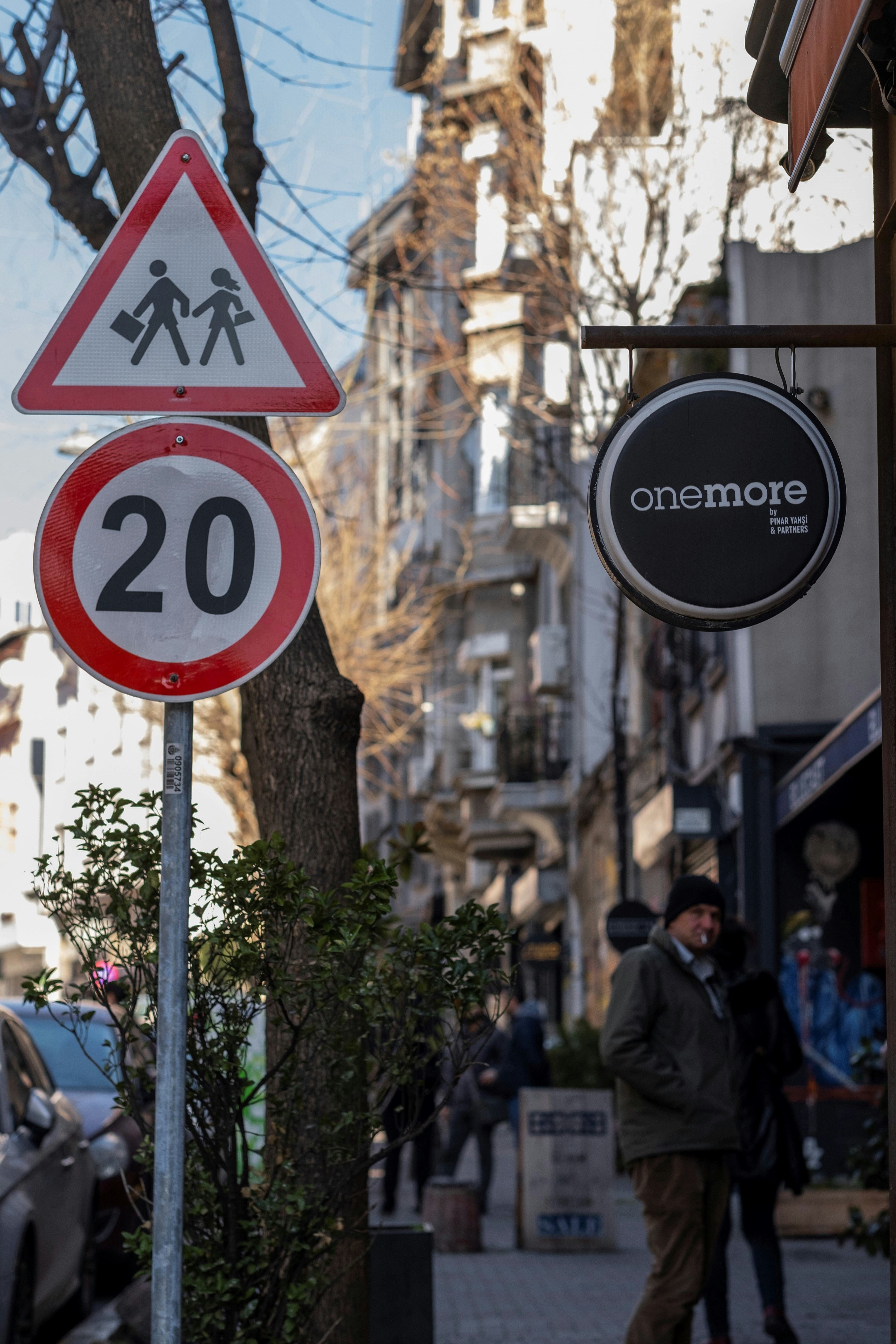 Urban Signpost and Cafe Circle: A Day in the Busy Street