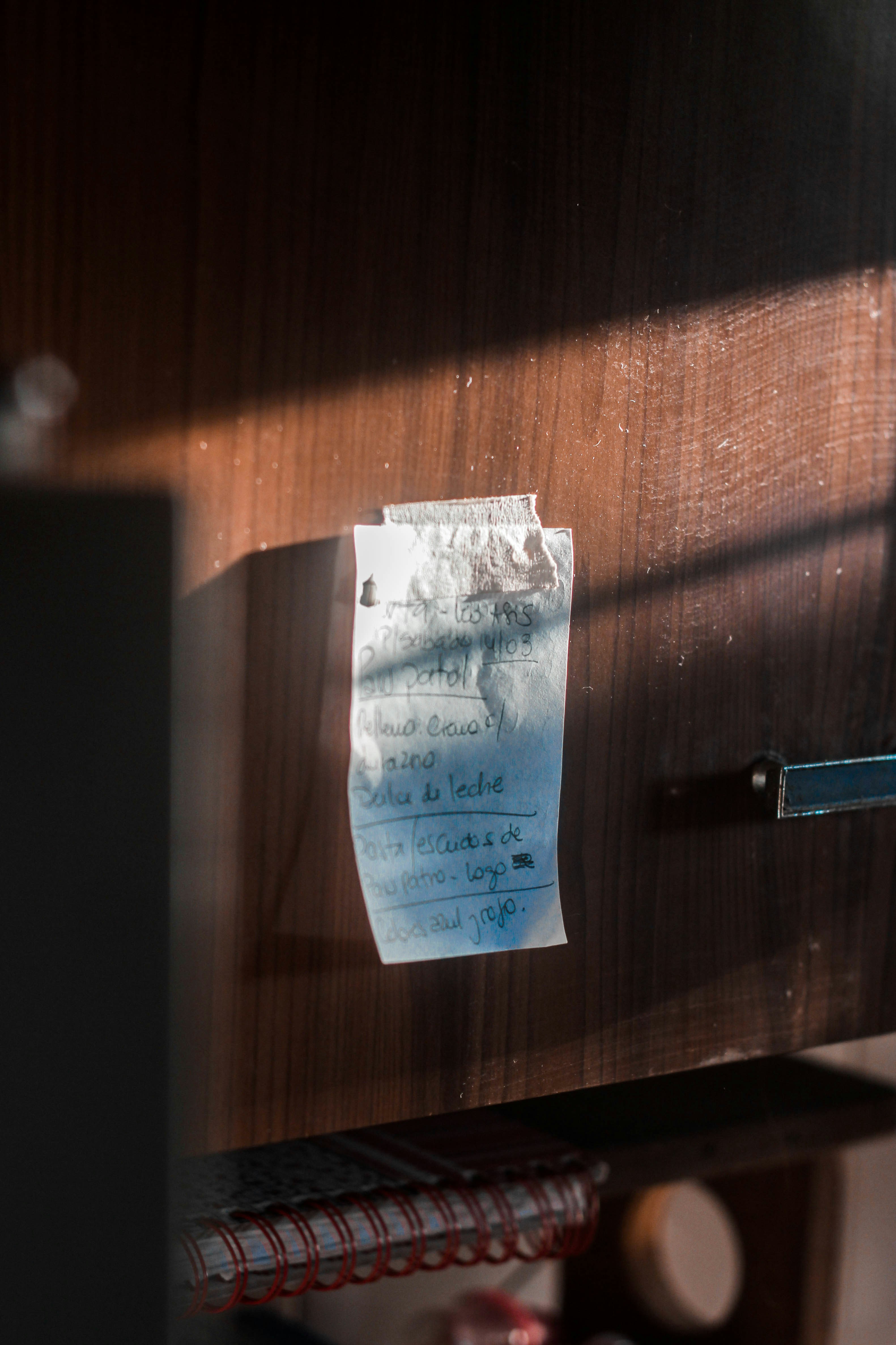 A Quiet Note in Diagonal Sunlight on a Walnut Desk