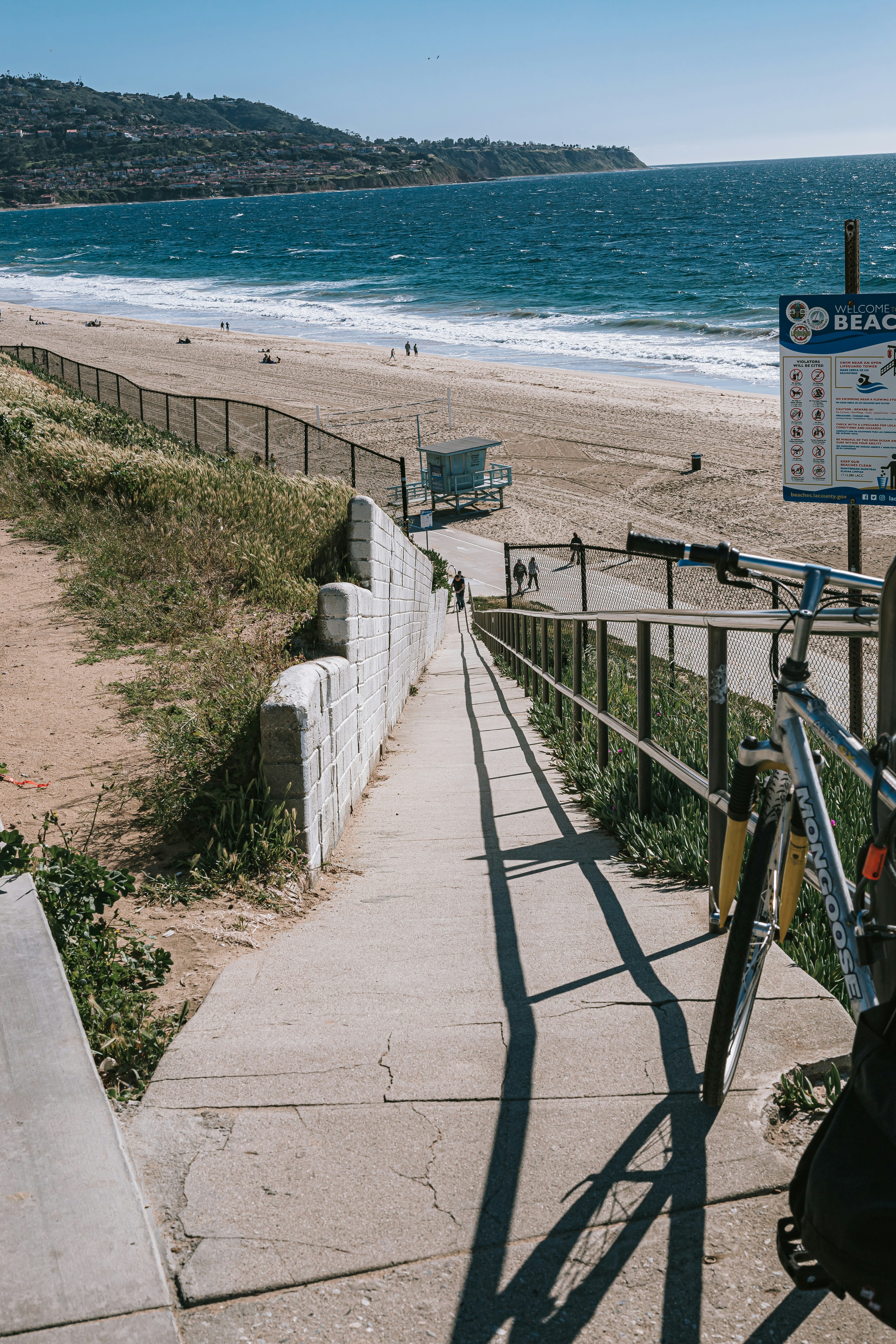 Staircase to the Sea: A Coastal Path Framed by a Bicycle