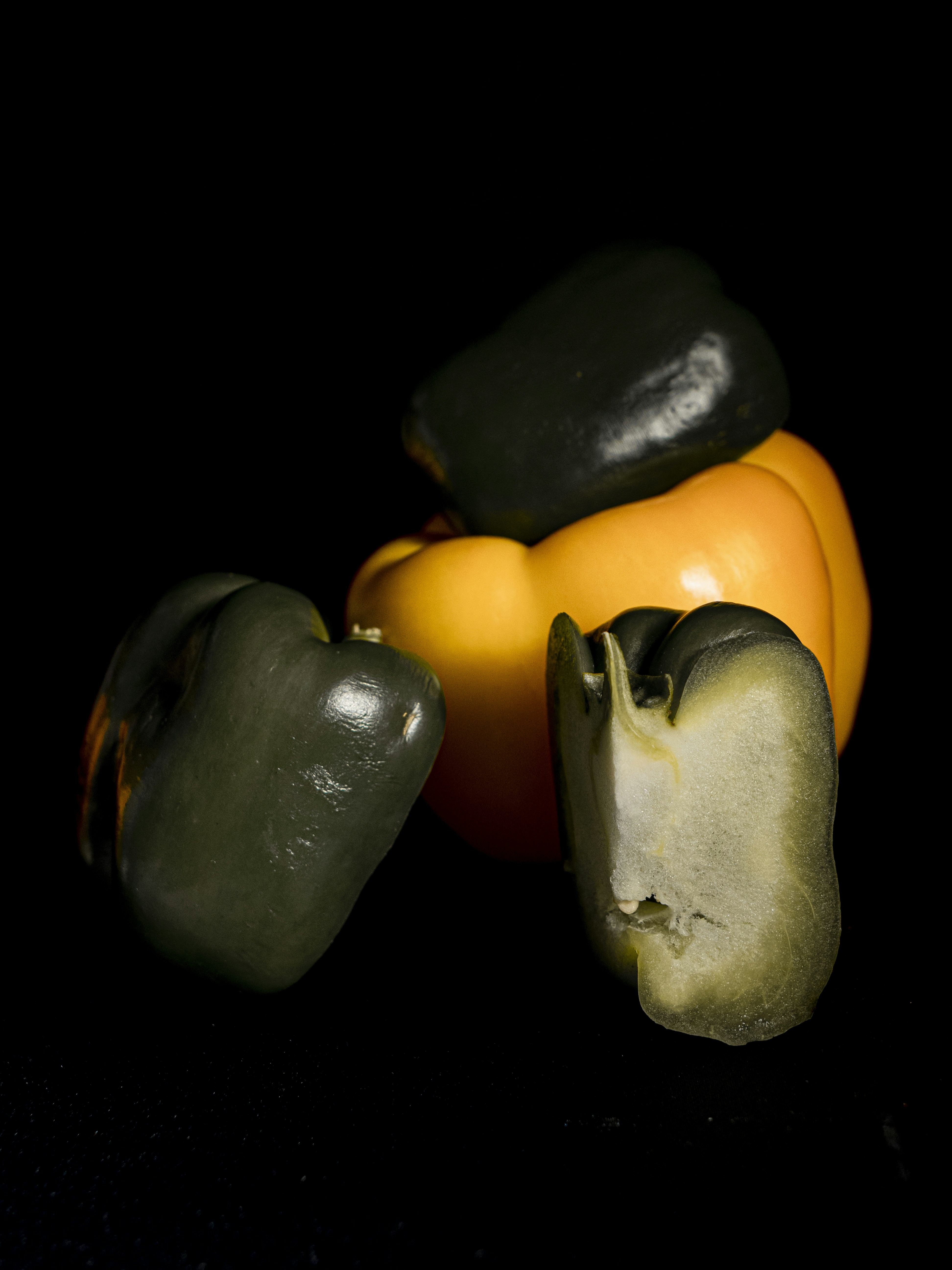 Emerald, Tangerine, and Shadow: A Quiet Still Life of Peppers