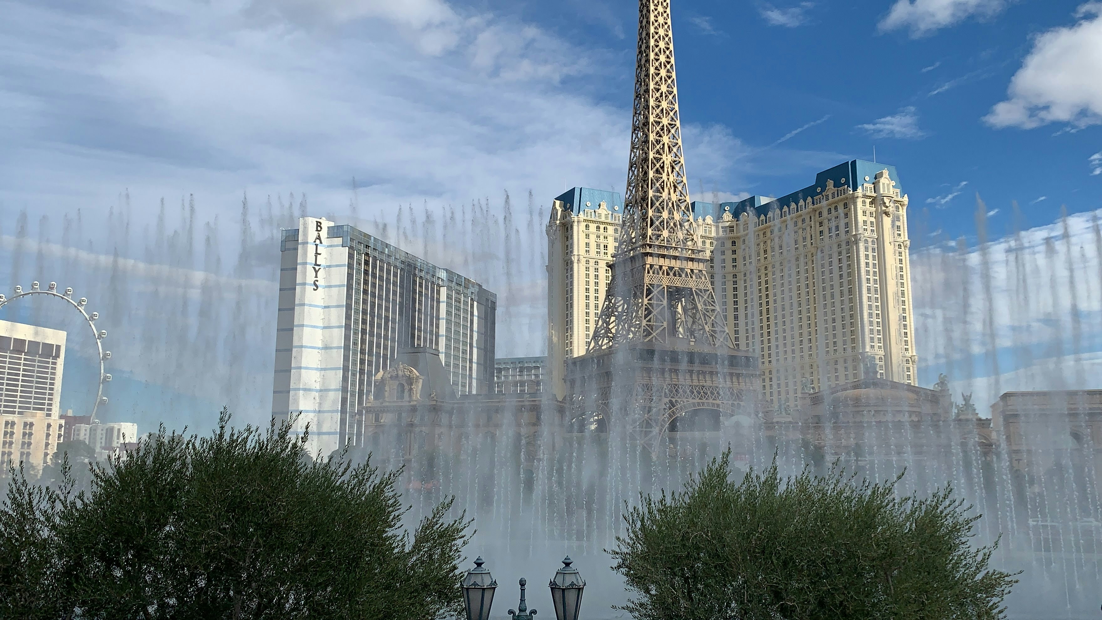 People walking on sidewalk near high rise buildings during daytime ...