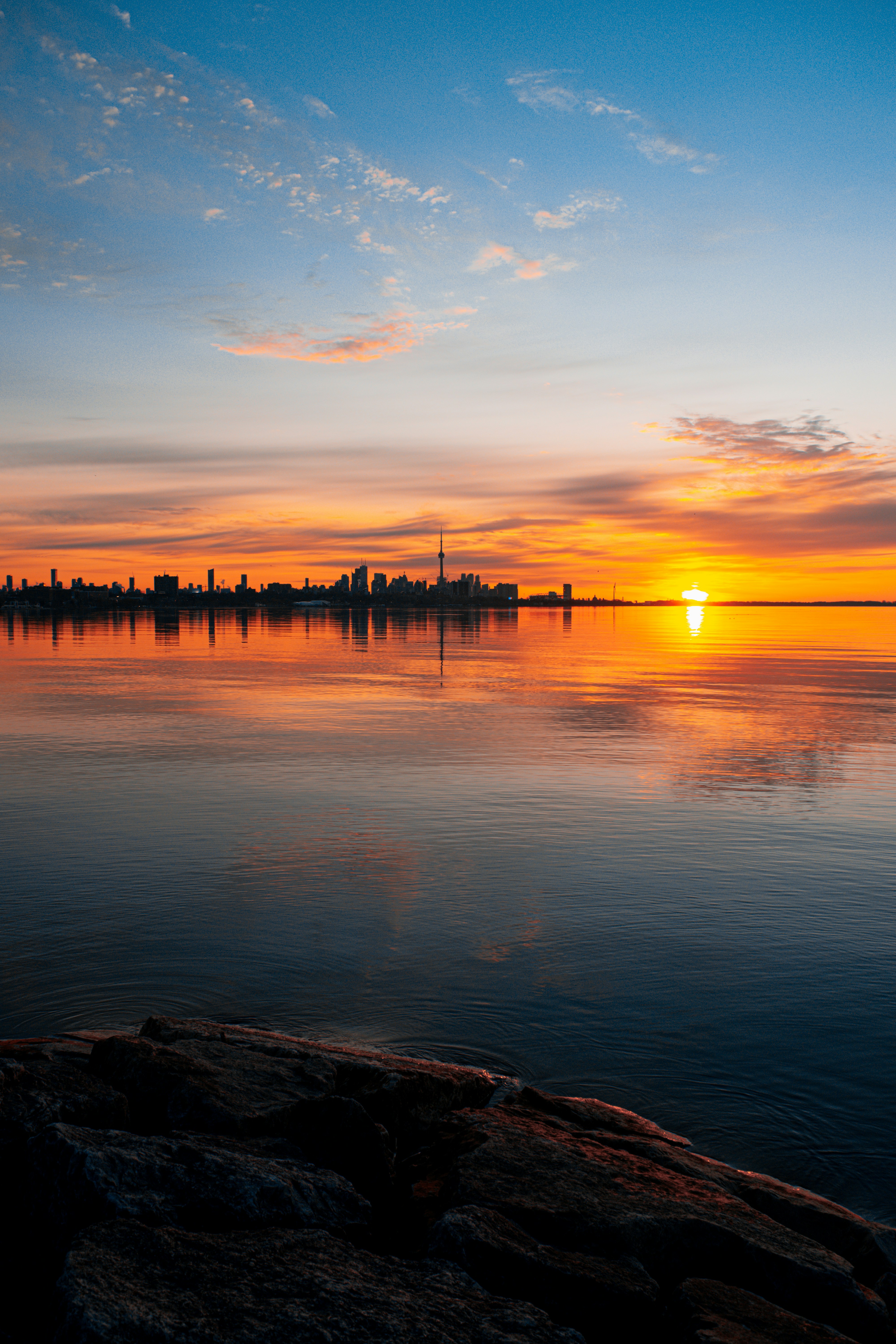 "Wake up for the sunrise, stay out for the moon." | silhouette of dock on body of water during sunset