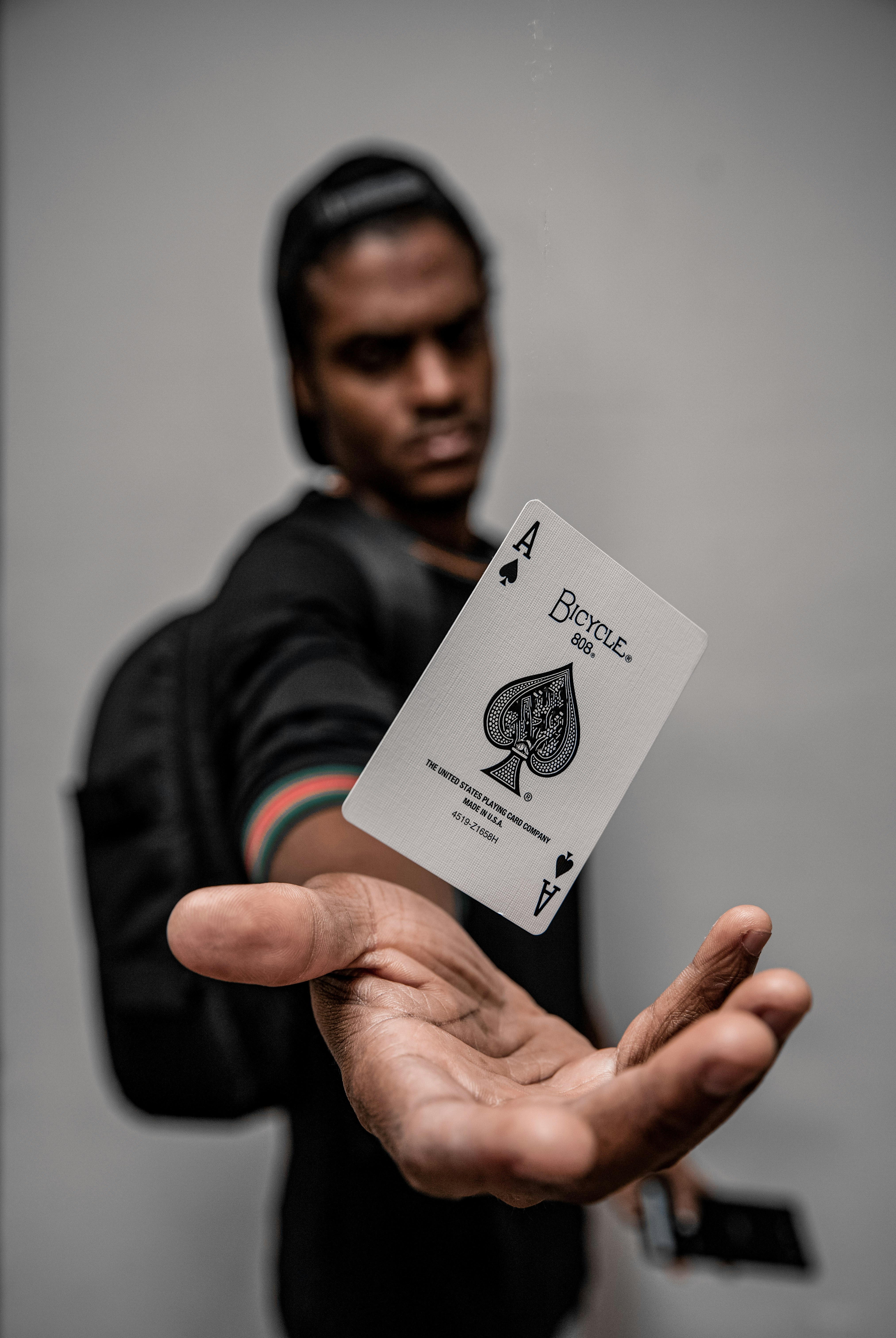 Man holding ace of spade card photo – Free Human Image on Unsplash