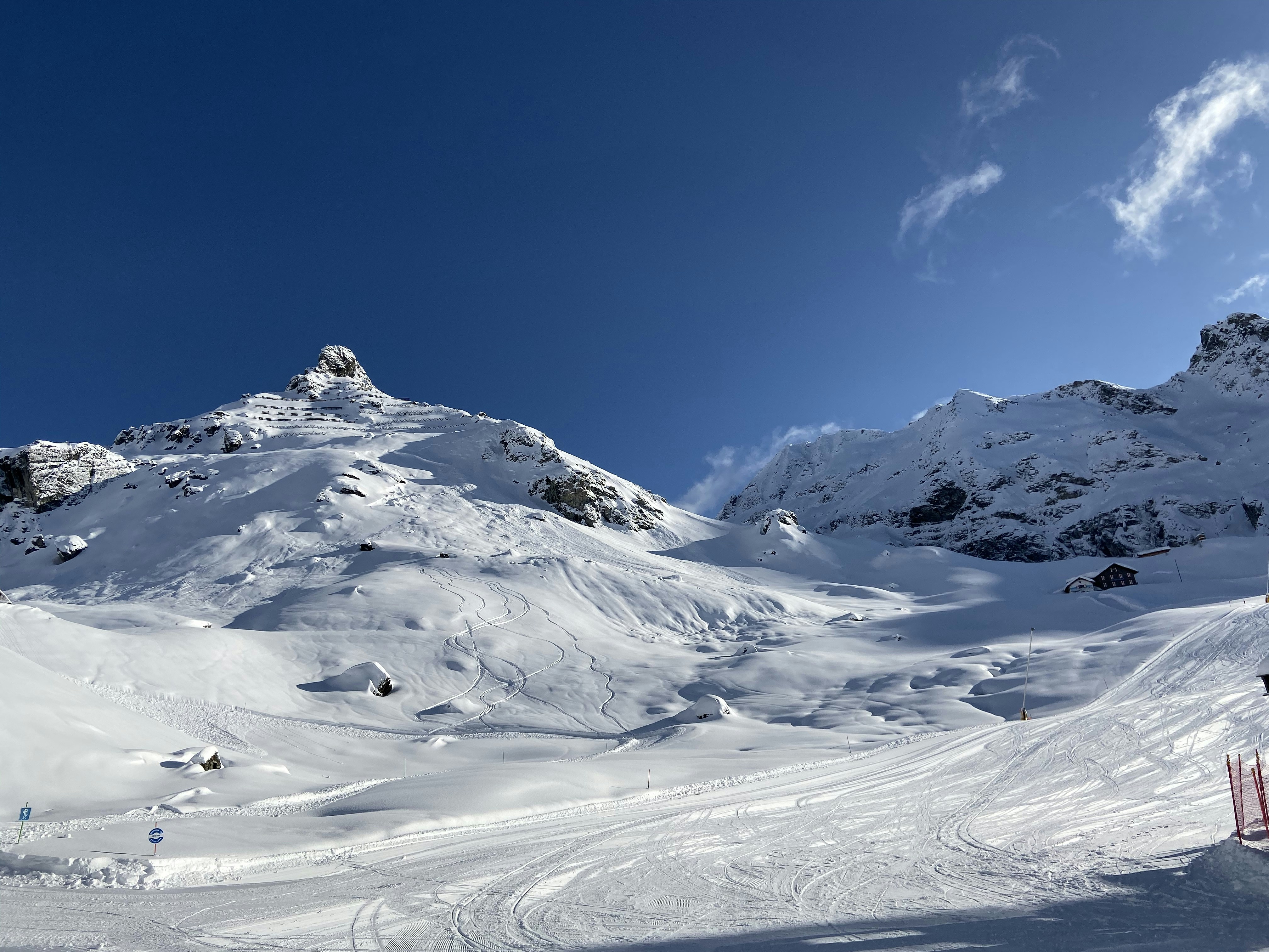 The Silent Spine: Snow-Covered Peak Beneath Pristine Alpine Blue