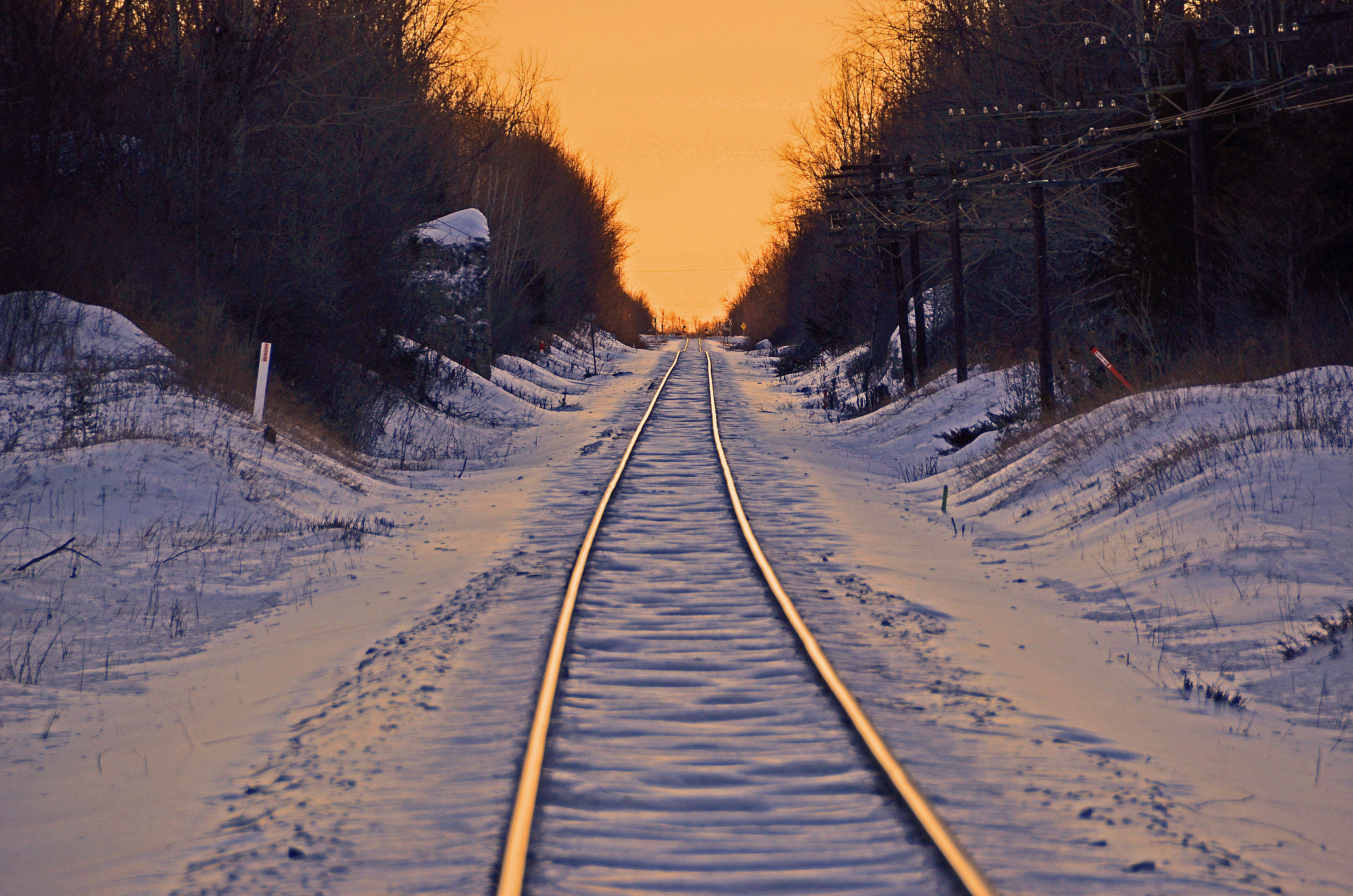 Horizon Rails: Snowbound Silence Under a Copper Sky