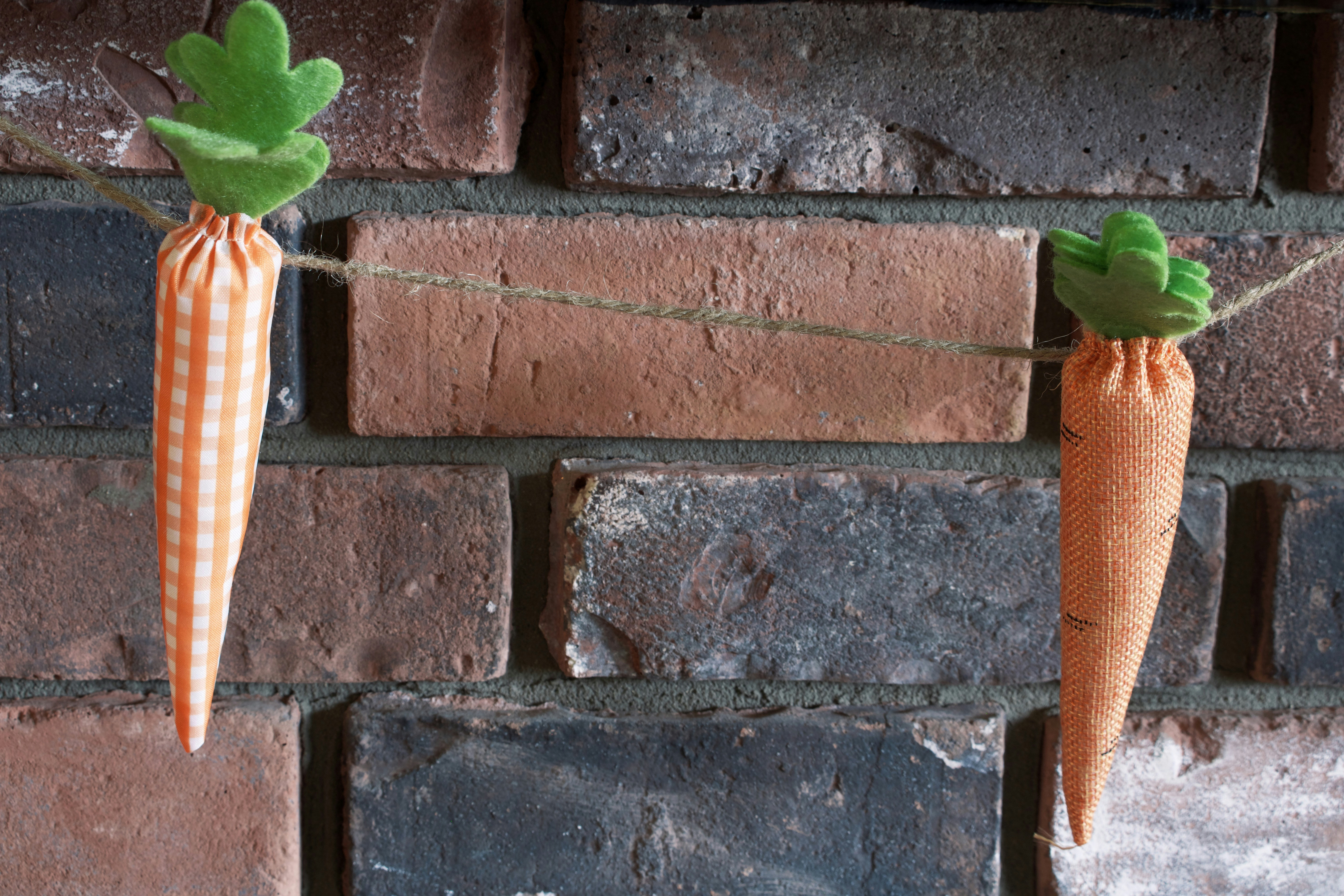 Felt Carrot Ornaments Framing a Rustic Brick Backdrop