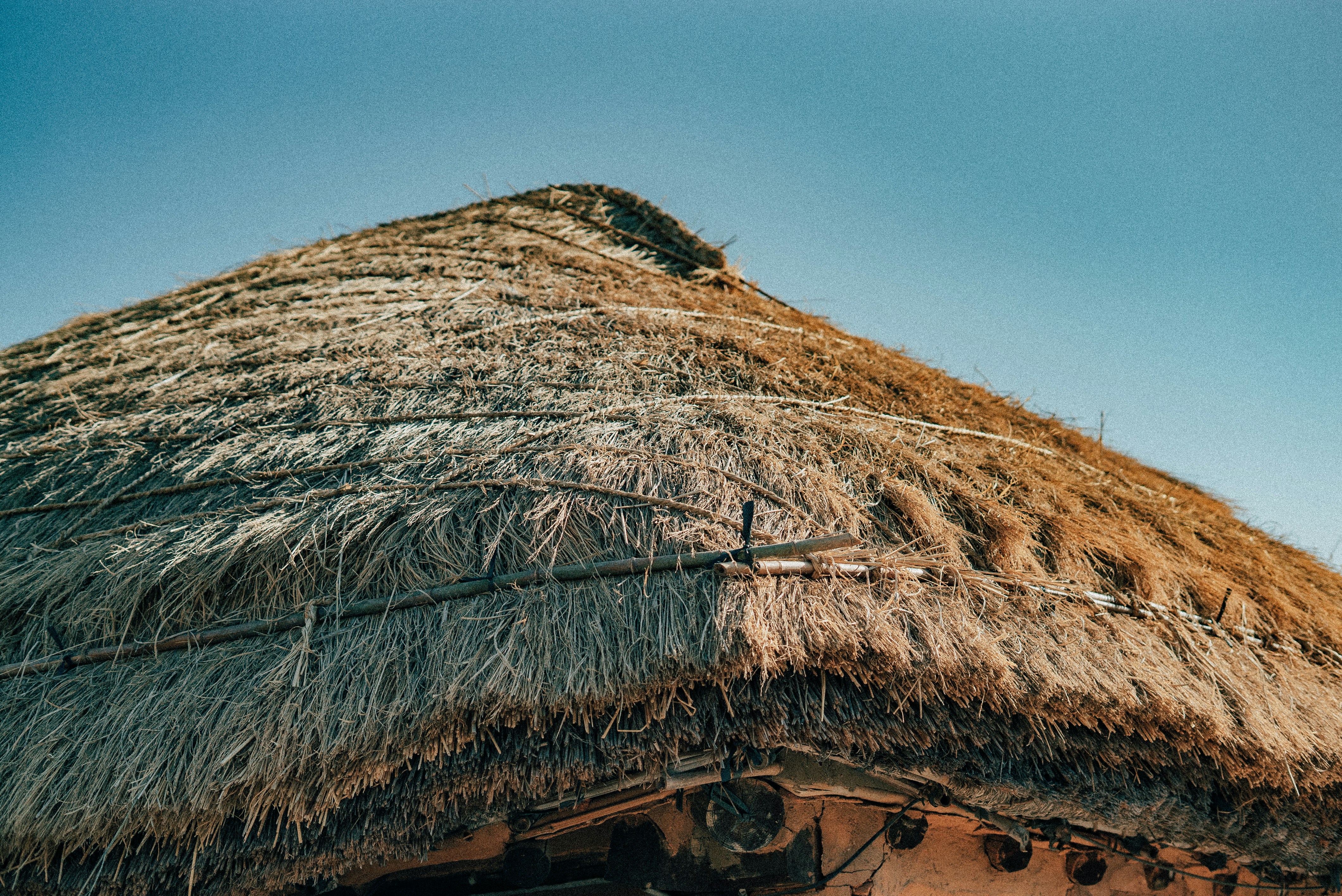 brown wooden house under blue sky during daytime