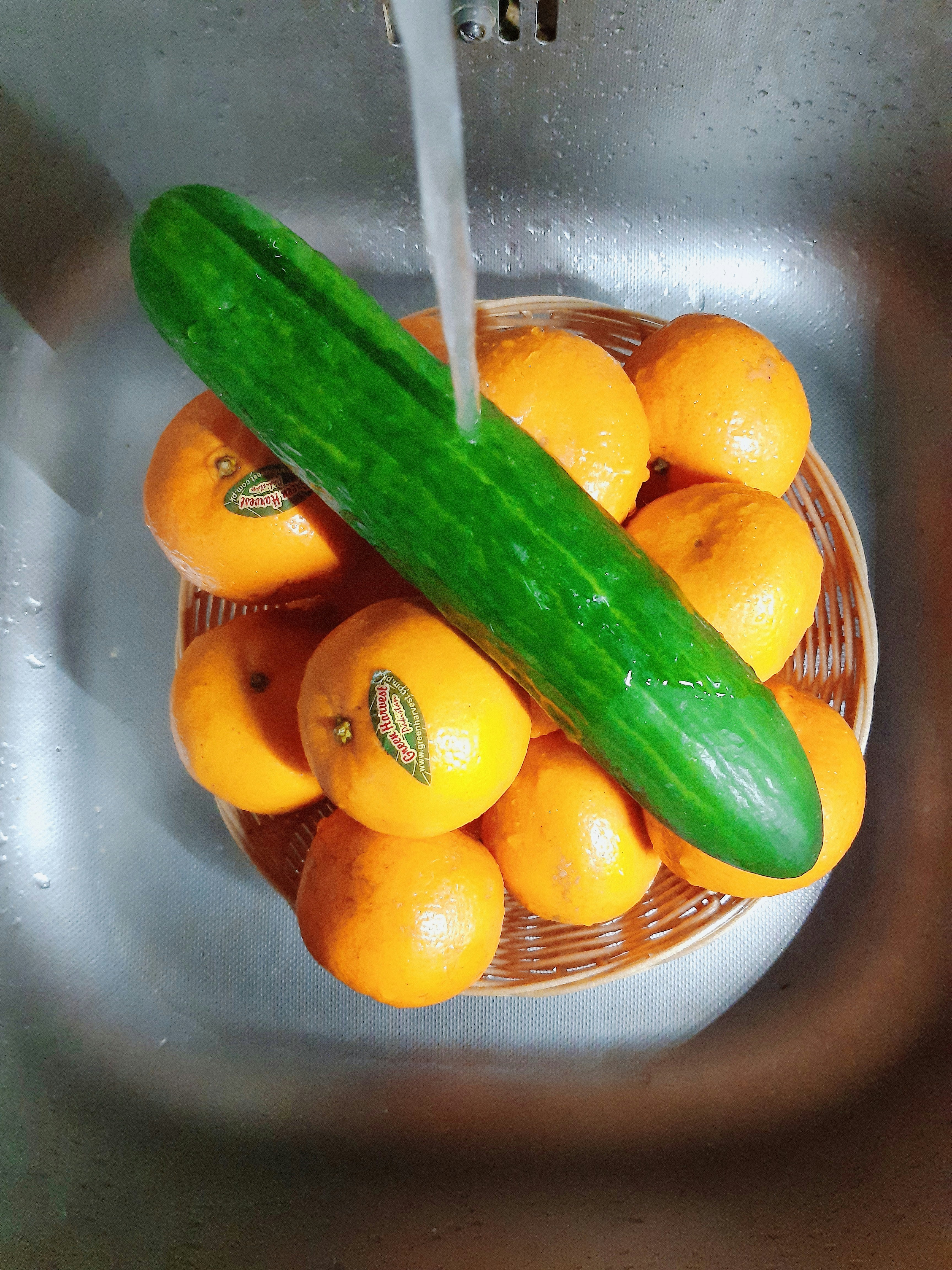 orange fruits on brown woven basket