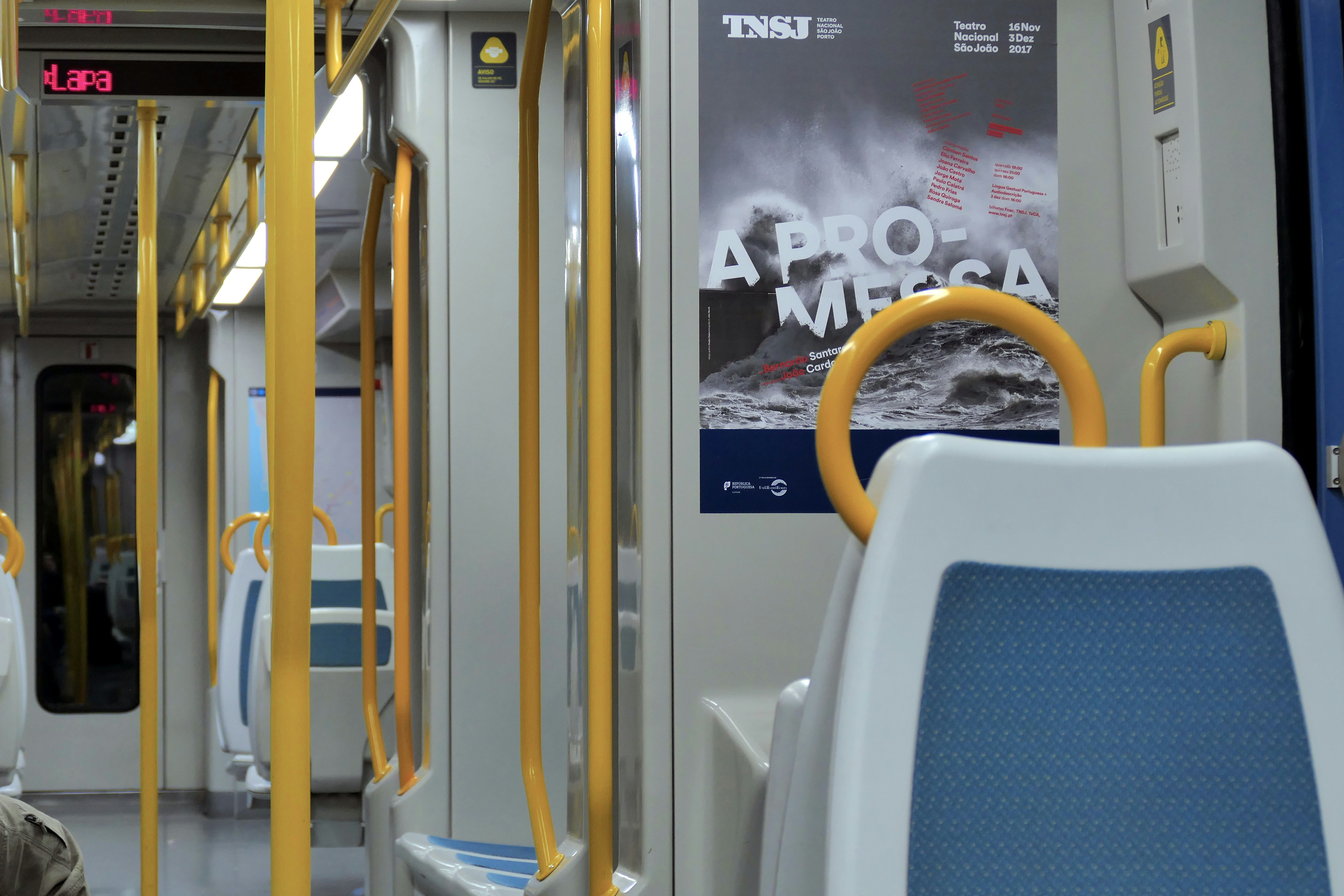 Circular Yellow Handrail Framing a Quiet Subway Moment